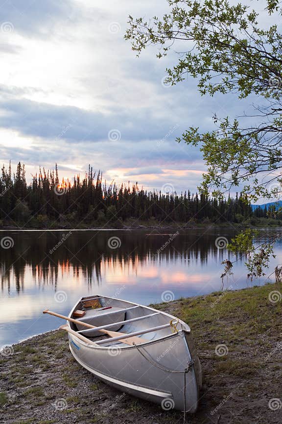 Sunset Sky and Canoe at Teslin River Yukon Canada Stock Image - Image ...