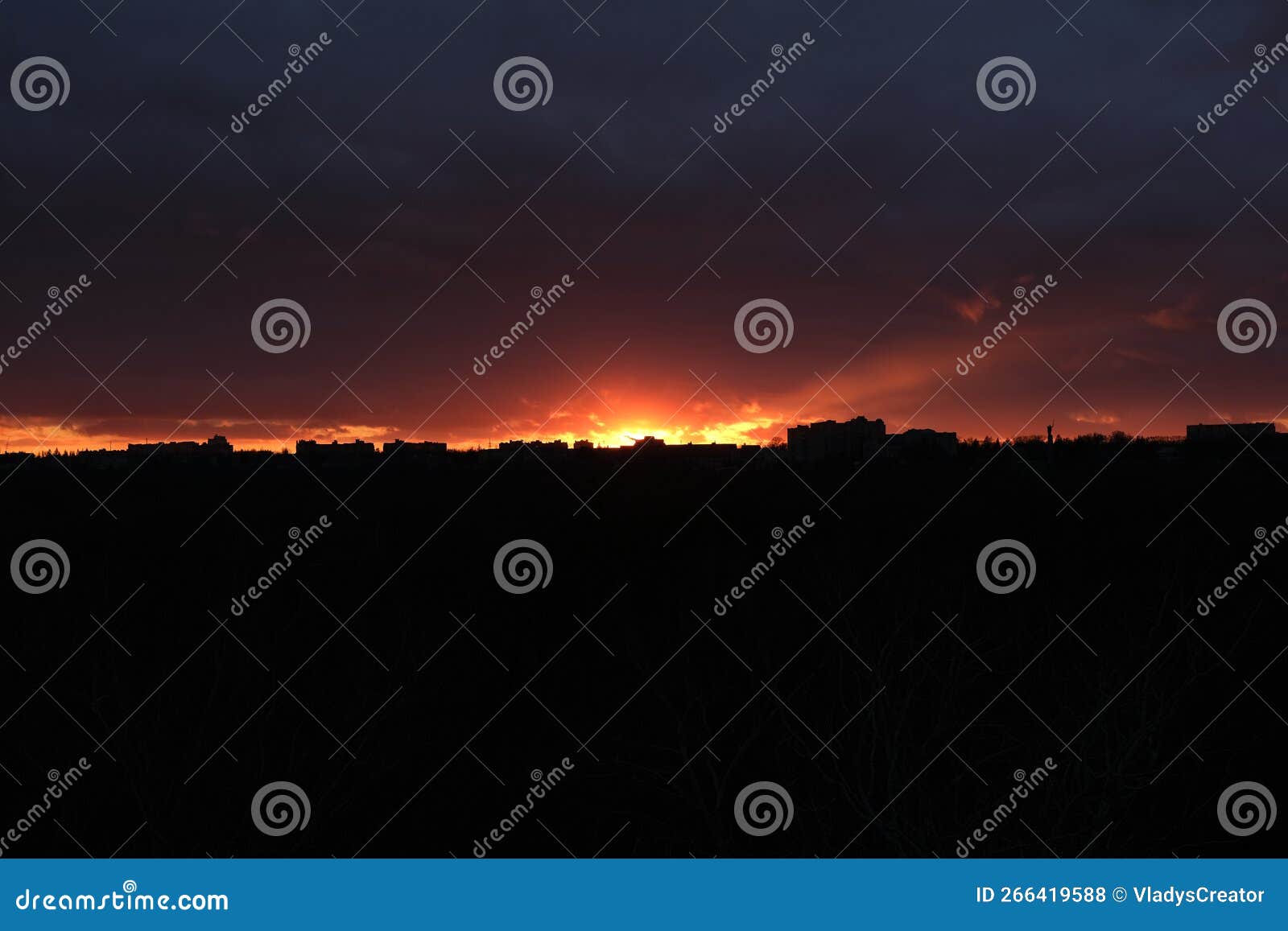 Sunset Sky with City in the Shadow Background and Red Tones of the ...