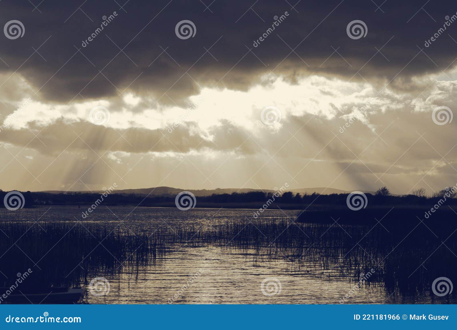 Sunset Sky Over a Lake.Dark and Dramatic Scene, Sun Rays Burst from the ...