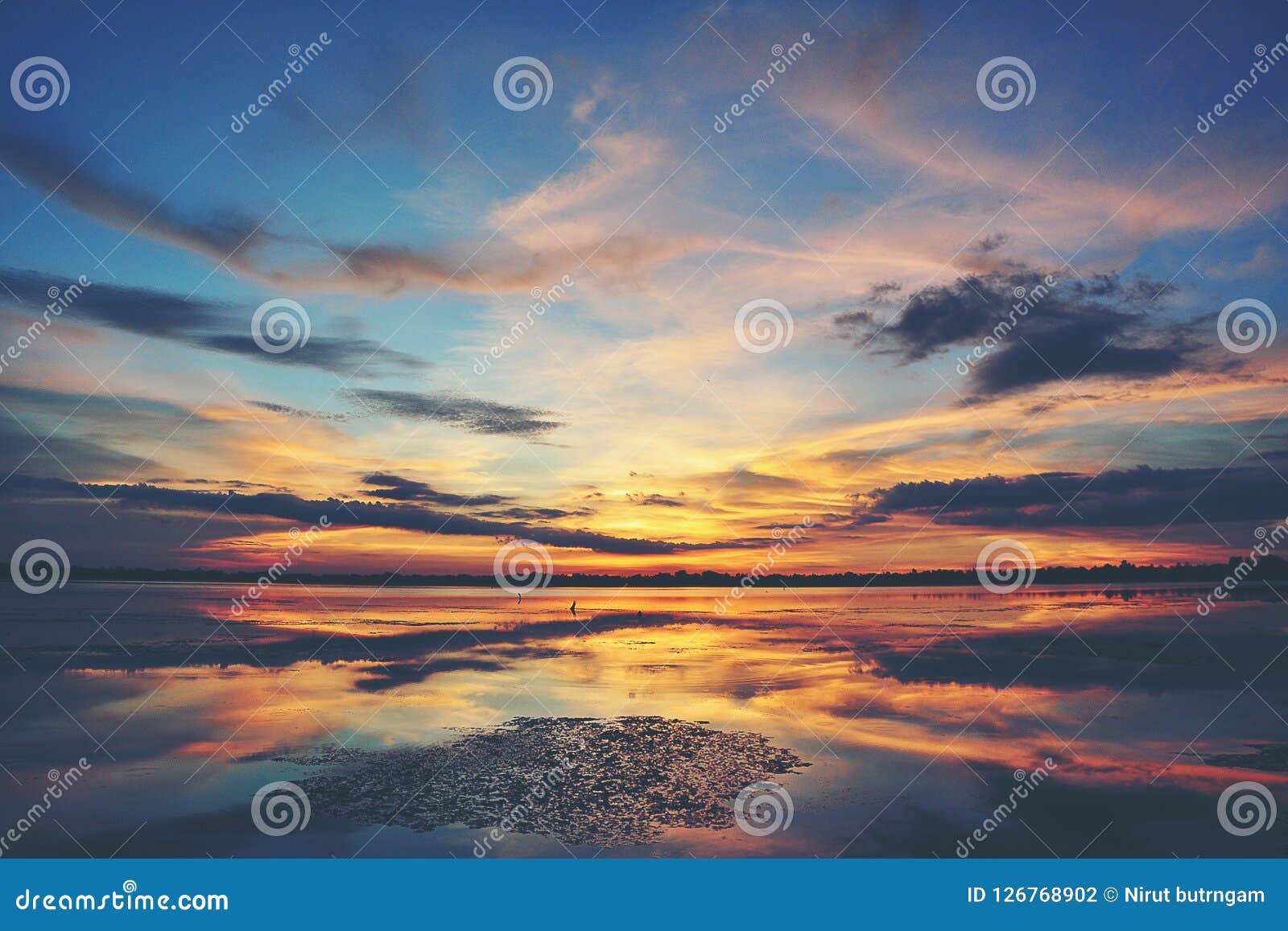 The Sunset Sky and the Reflection on the Water. Stock Photo - Image of ...