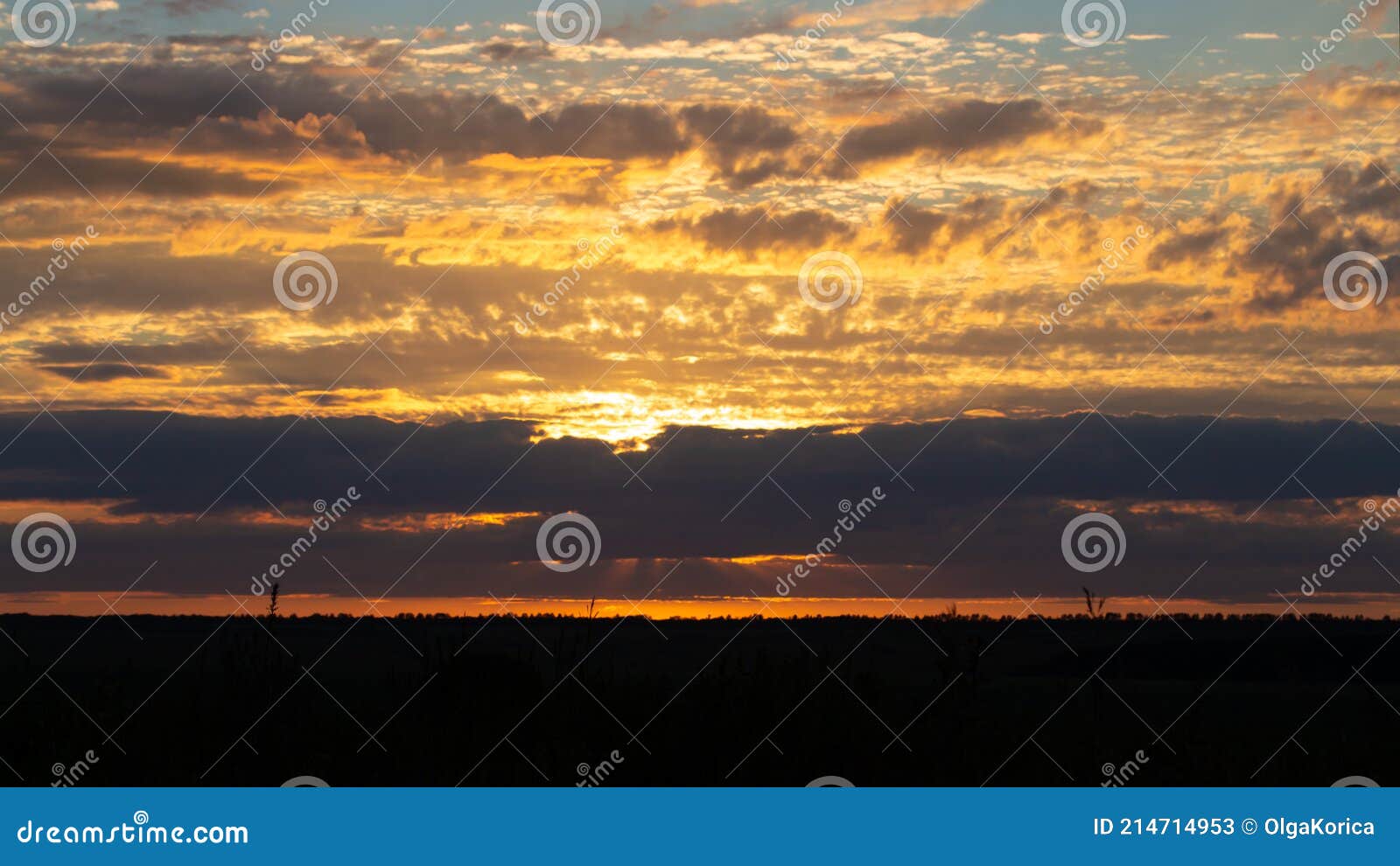 Sunset Sky with Thick Purple Clouds, a Ray of the Setting Sun Breaking ...