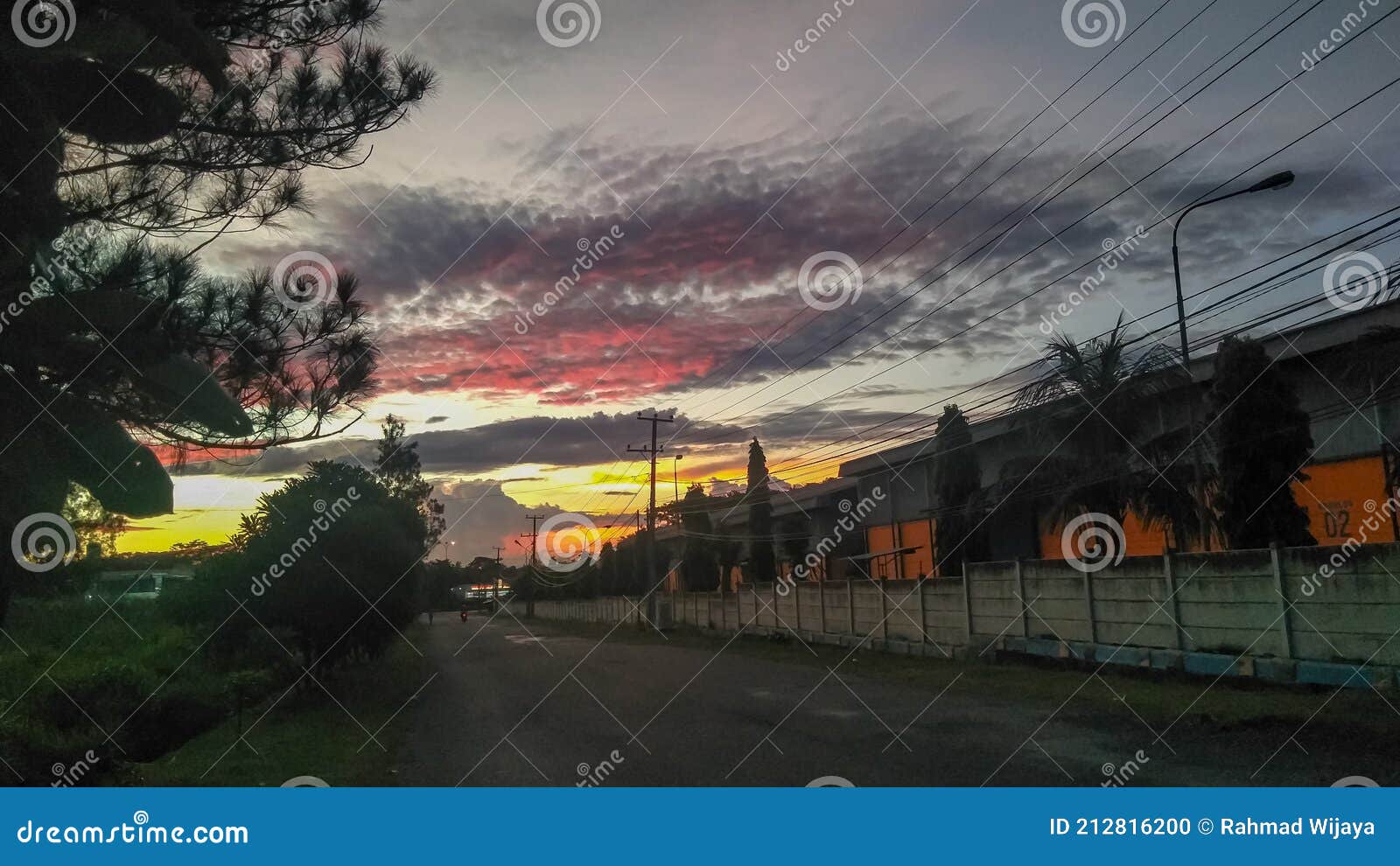 The sunset on the street stock photo. Image of orange - 212816200