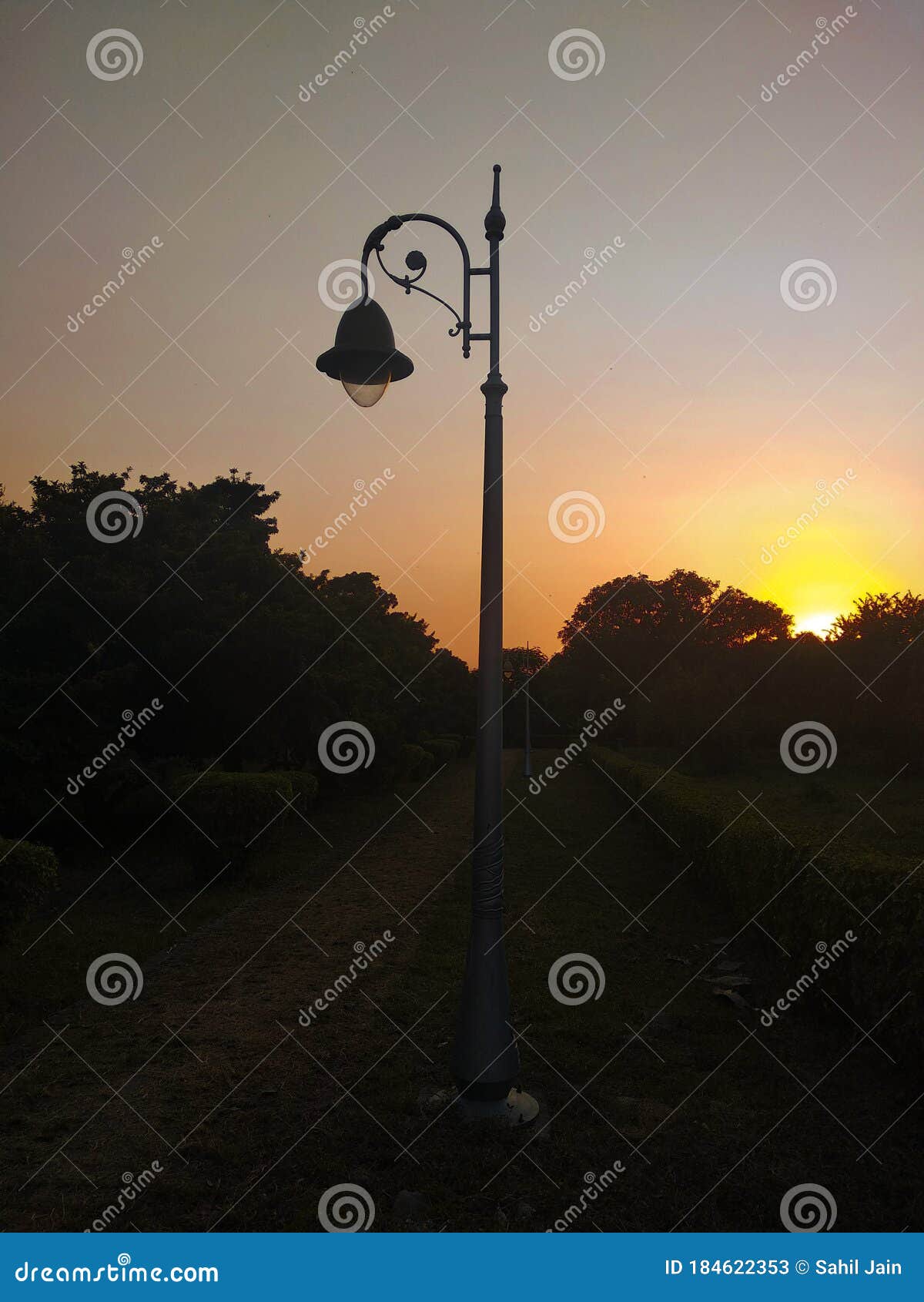 Sunset and street light stock image. Image of wind, evening - 184622353