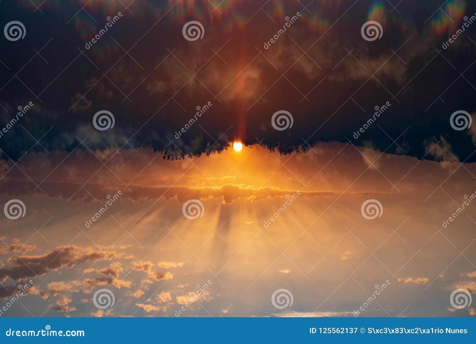 Sunset with Sun almost Hidden and Shadows on the Clouds and Blue Stock ...