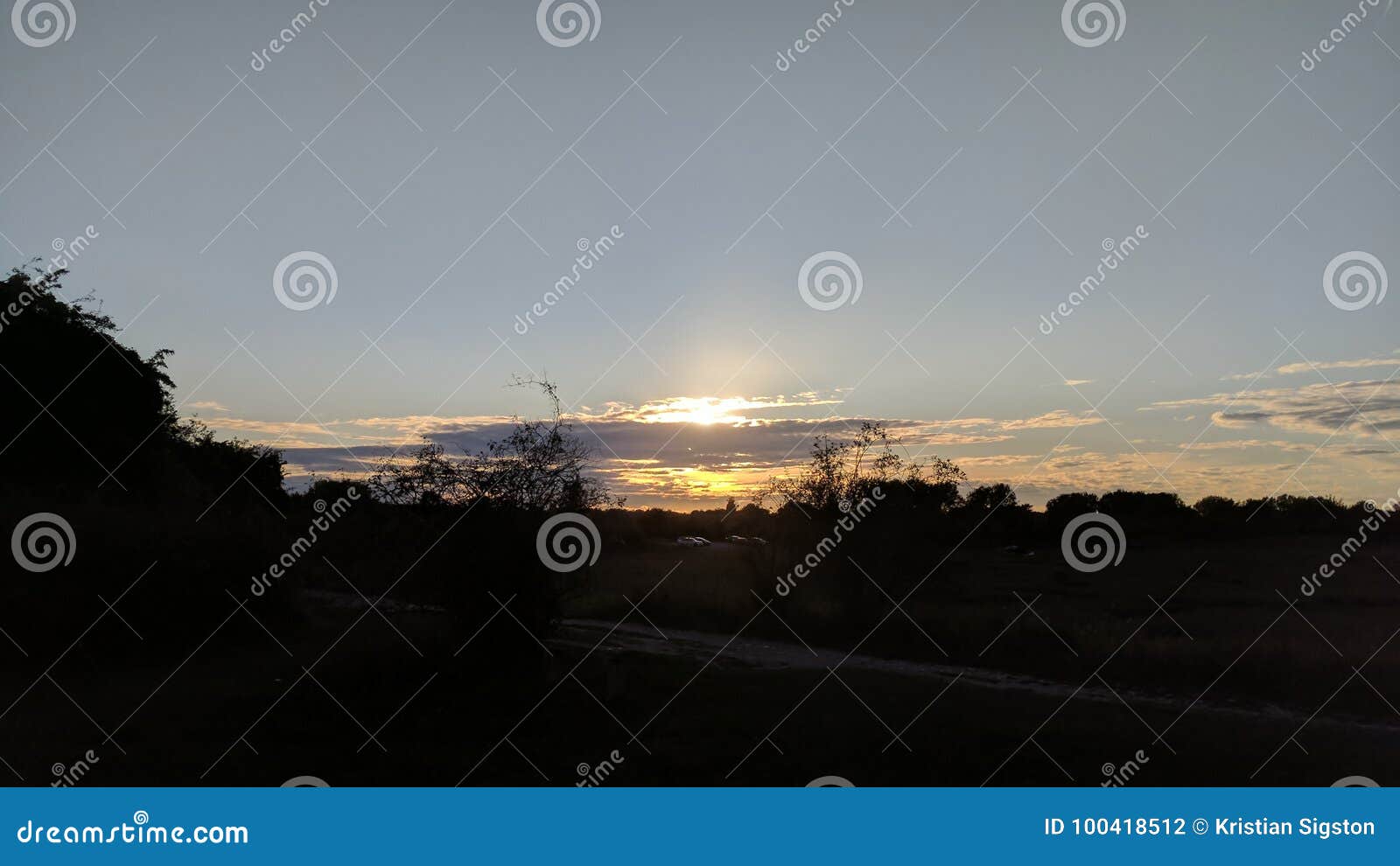 Sunset with Sun Radiating Upwards in Arcs Stock Photo - Image of ...