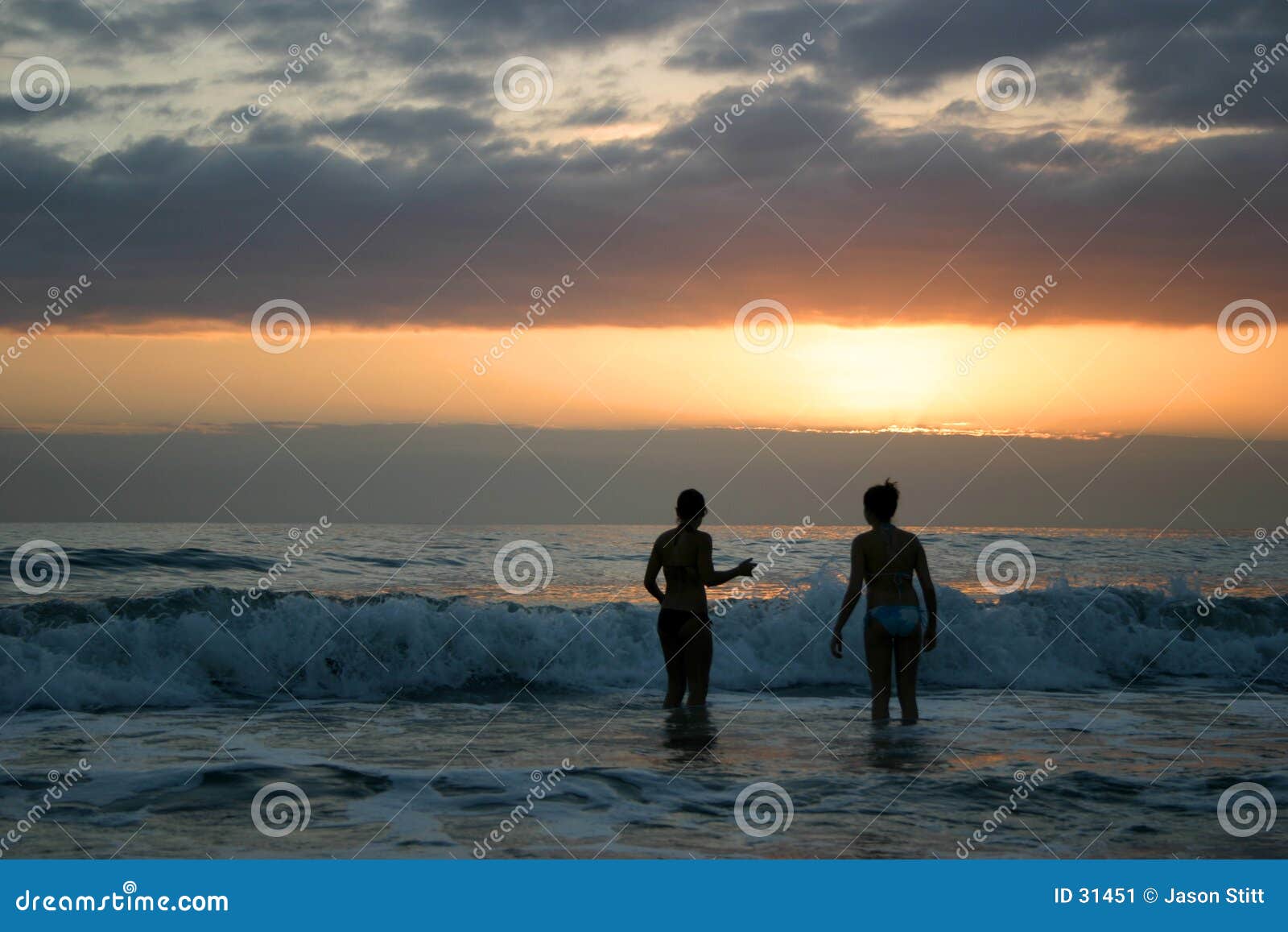 Sunset Swim stock image. Image of person, teens, cloud, wave - 31451