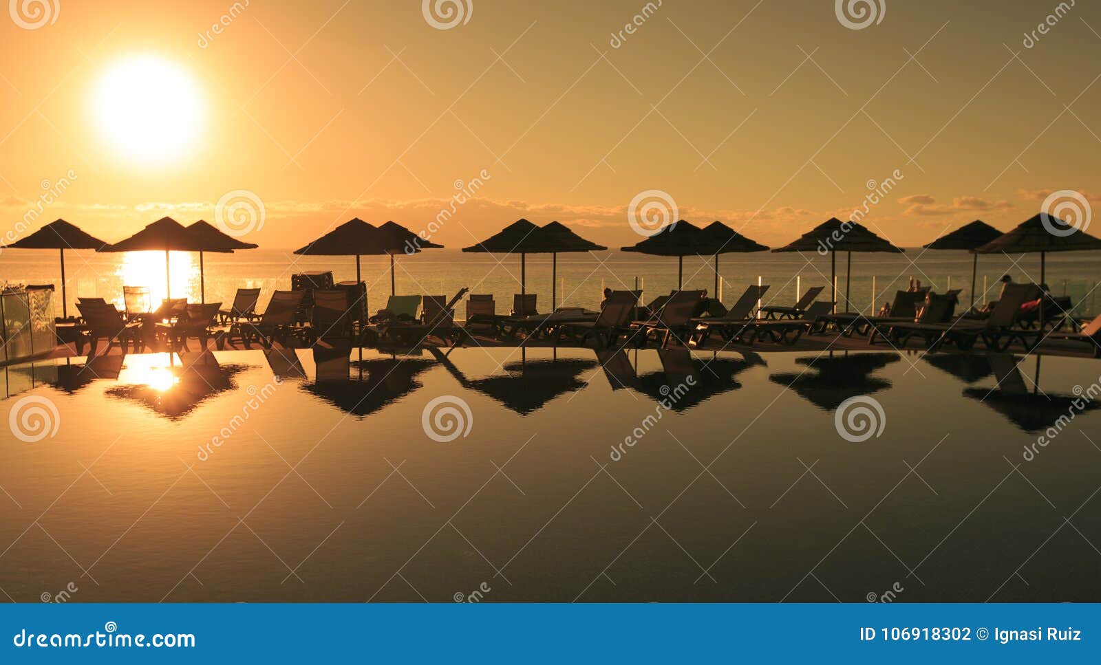 Sunset in a swimming pool stock photo. Image of mirror - 106918302