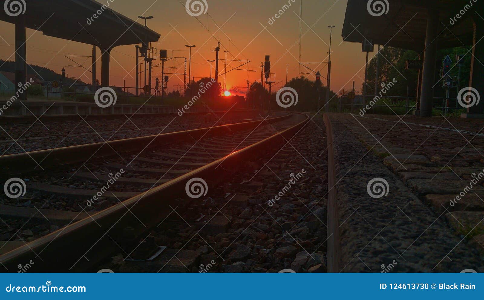 Sunset at Trainstation stock photo. Image of trainstation - 124613730