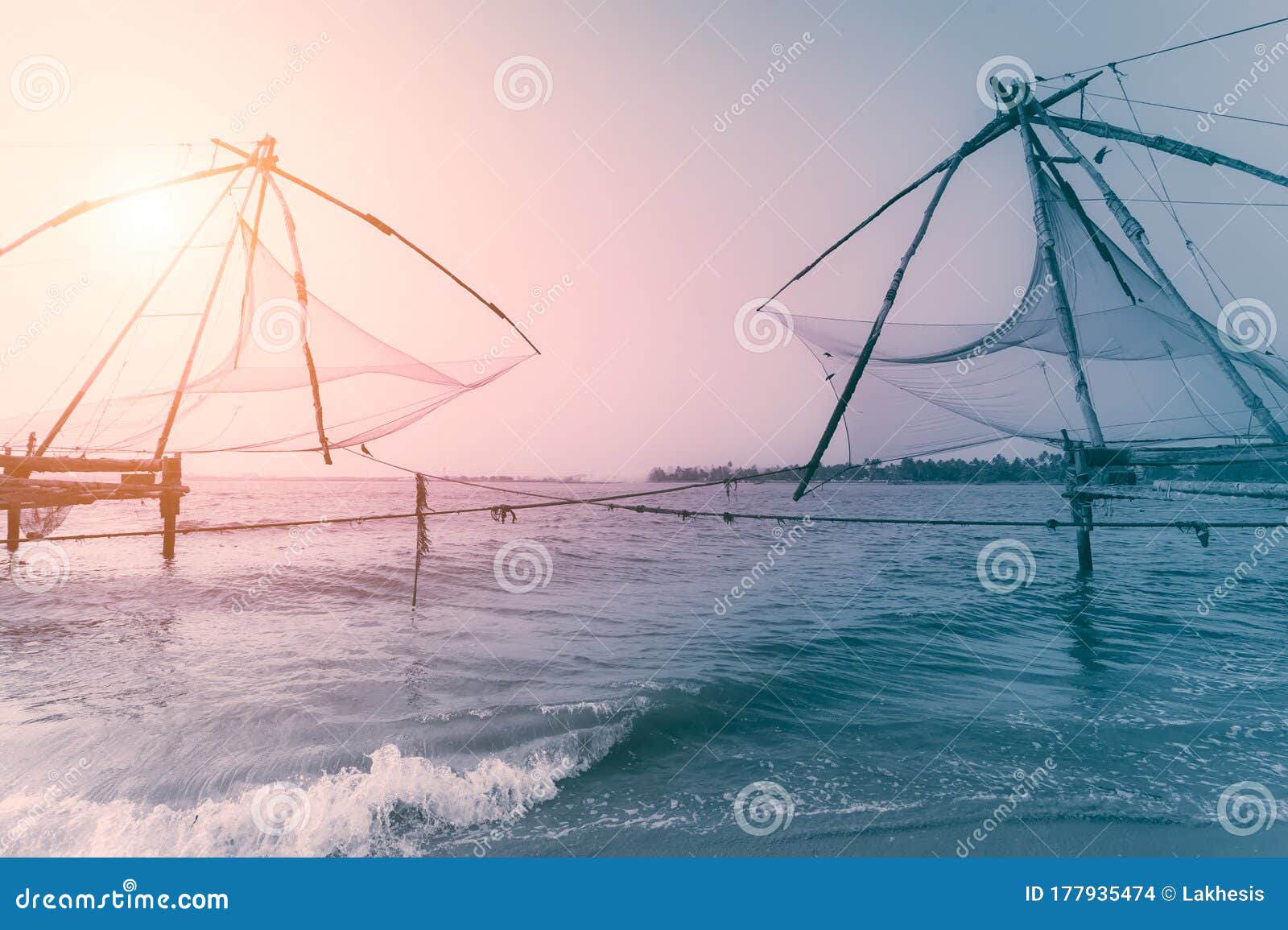 Sunset at Tropical Beach. Ocean Coast Landscape with Chinese Fishing ... Sunset at Tropical Beach. Ocean Coast Landscape with Chinese Fishing ...