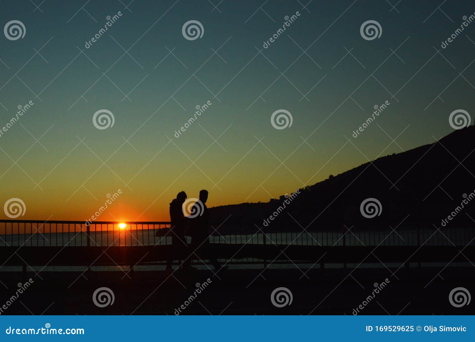 Sunset and two people stock image. Image of nature, color - 169529625