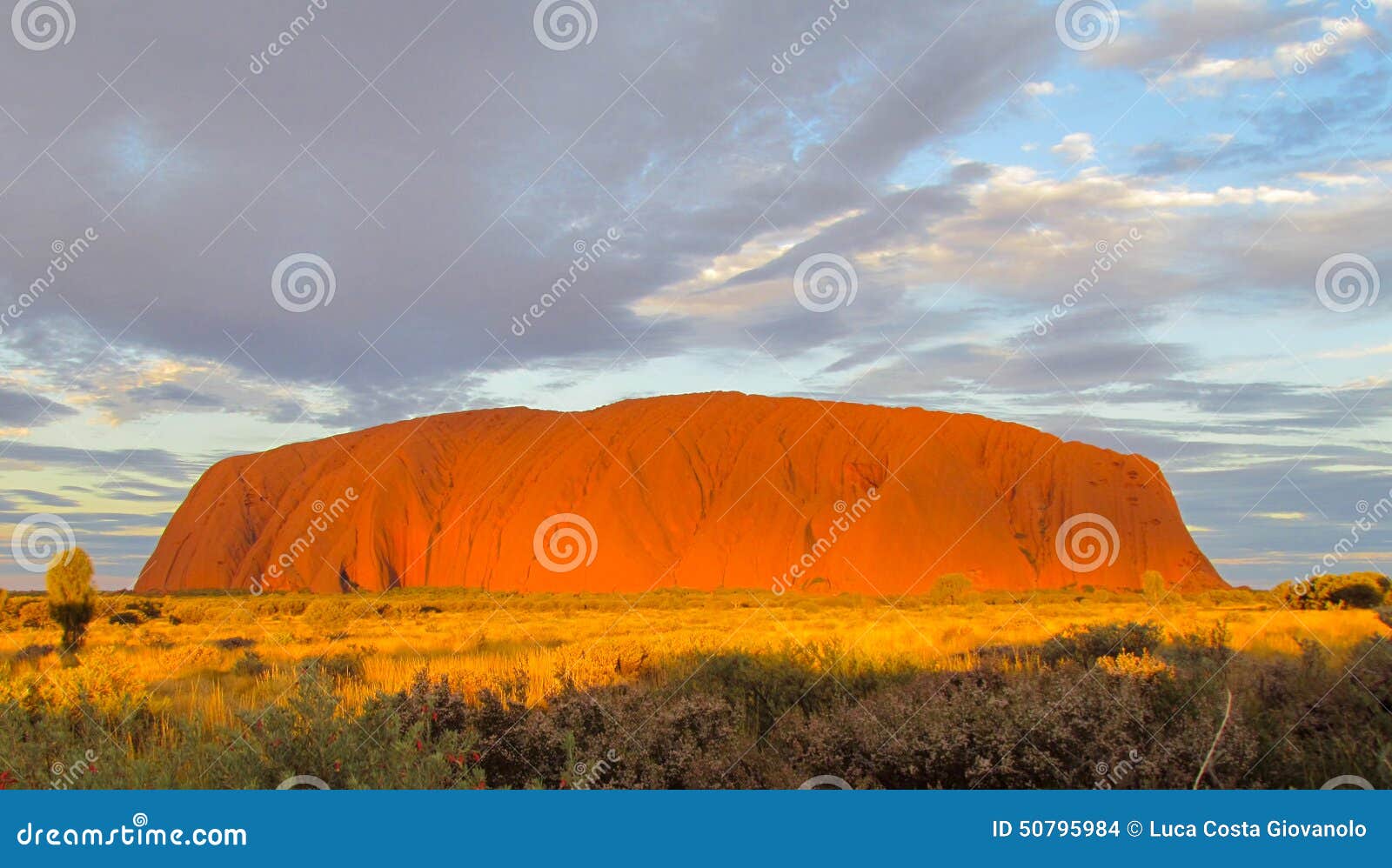 Sunset at Uluru Ayers Rock editorial stock image. Image of clouds ...