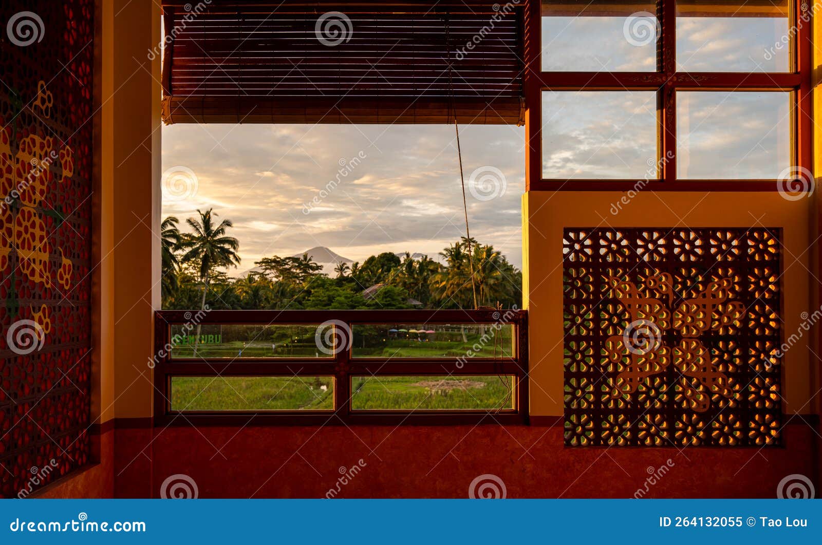 Sunset View through a Balinese Style Window with Volcano View in the ...