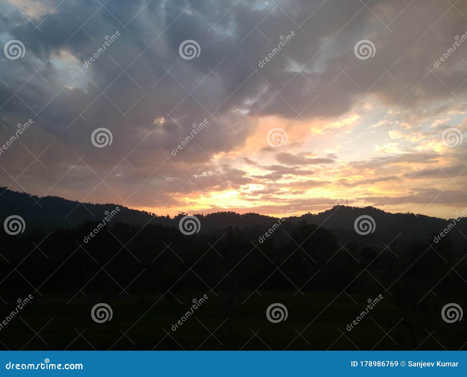 Sunset View with Hill and Clouds Stock Image - Image of hill, clouds ...