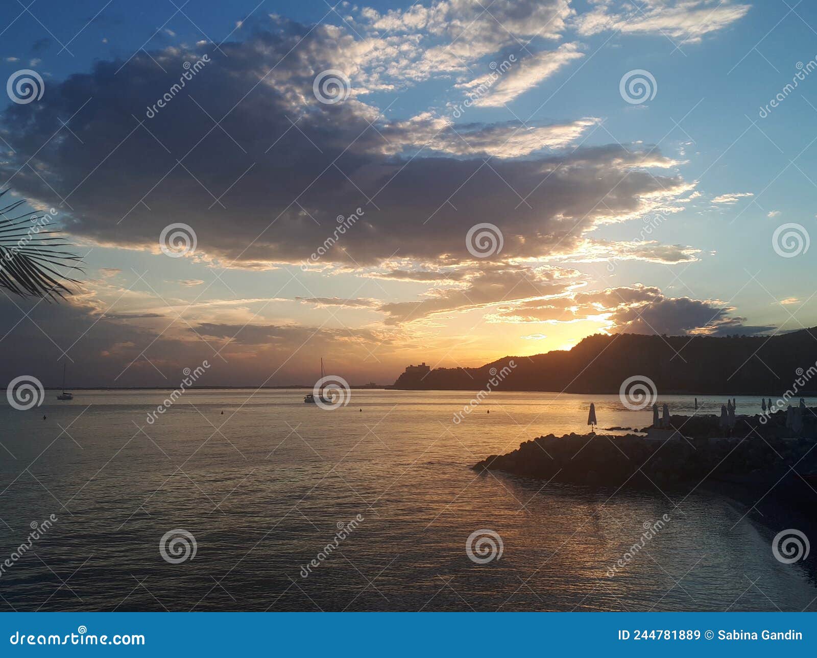Sunset view by the ocean stock image. Image of shore - 244781889