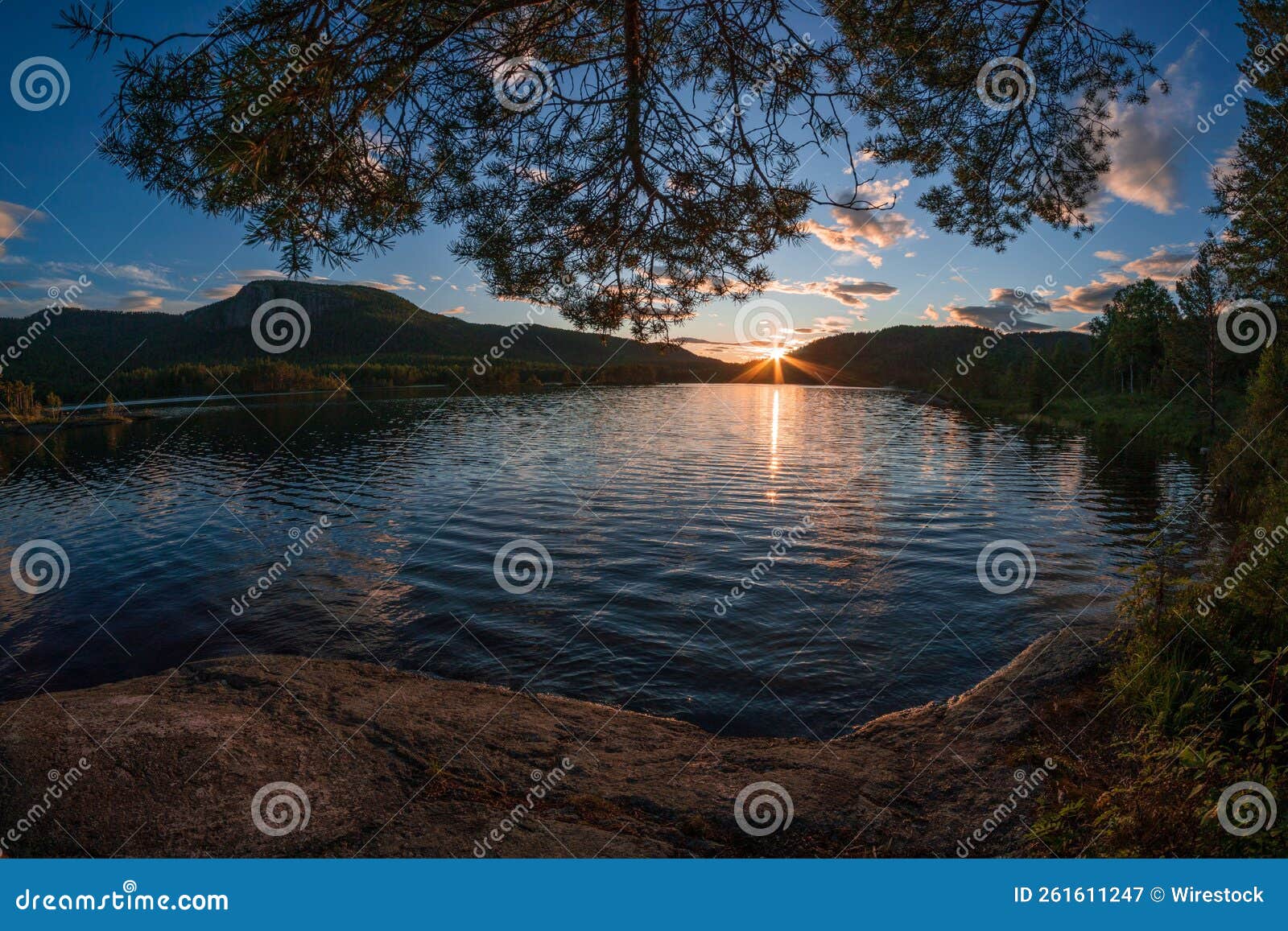 Sunset View of a Peaceful Lake Surrounded by Lush Greenery Stock Image ...