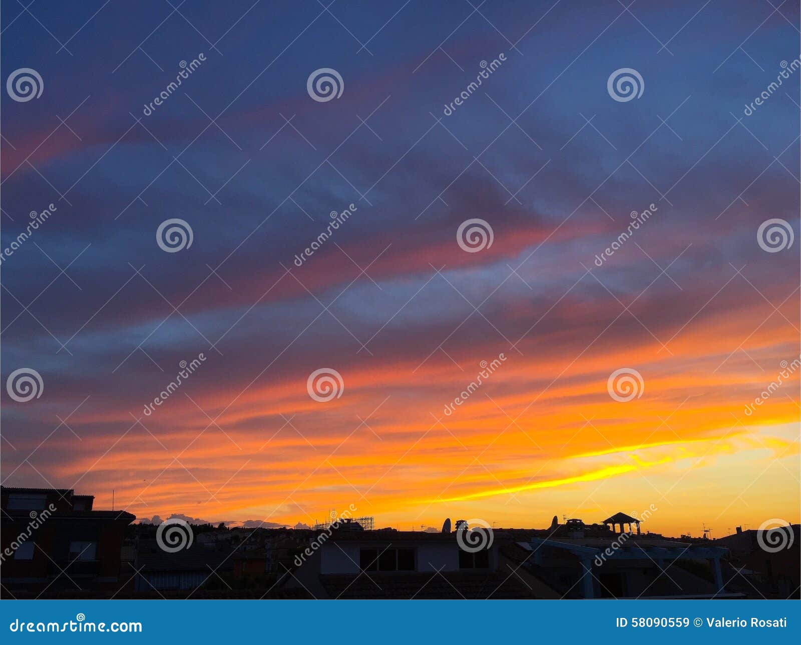 Sunset with warm clouds stock image. Image of sunset - 58090559