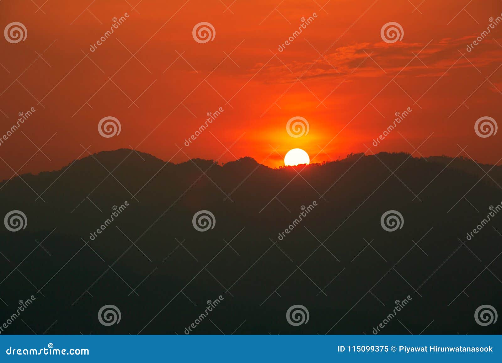 Sunset in Warm Orange Sky with Shadow of Mountain Range in Foreground ...