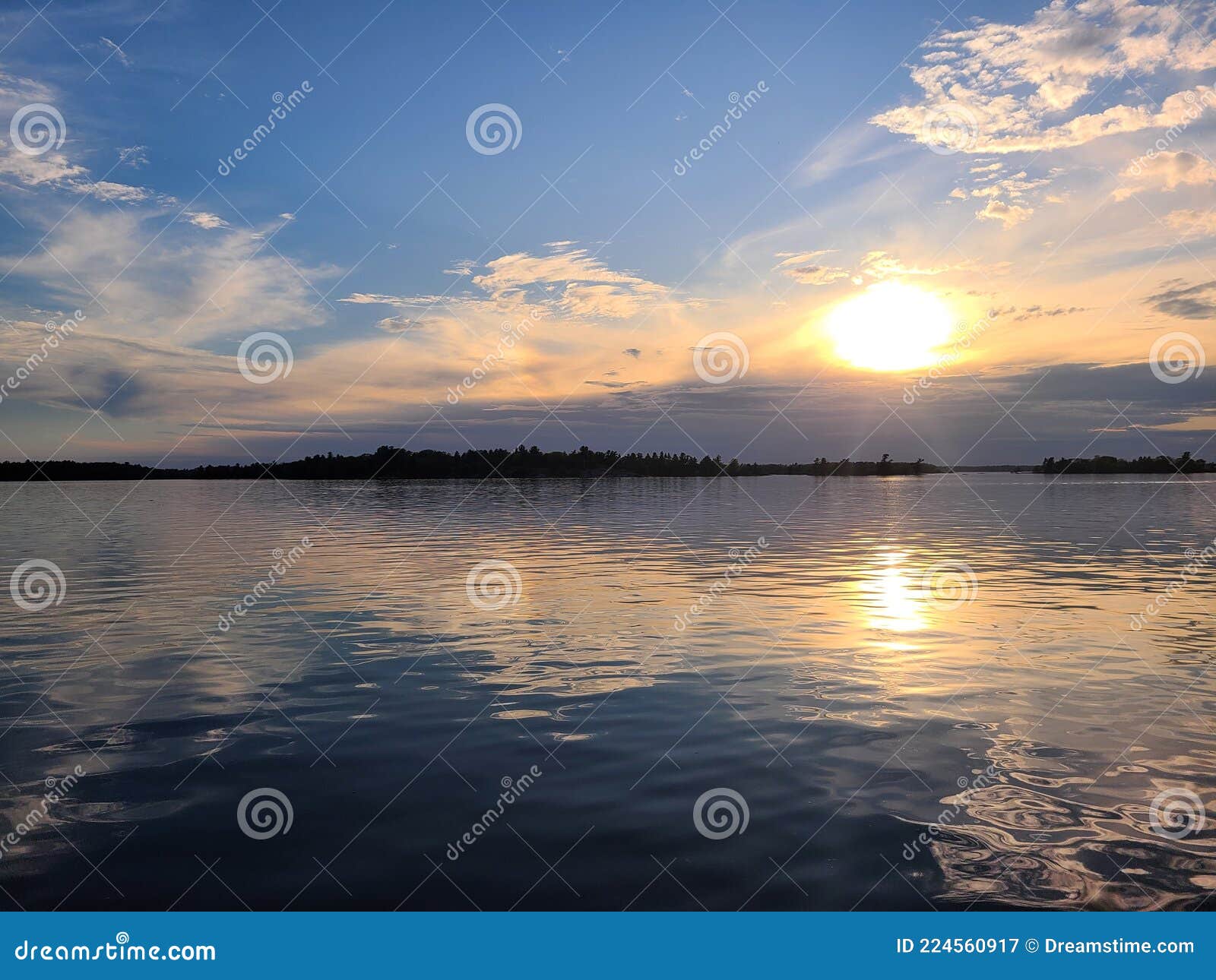 Sunset on the water stock image. Image of tranquil, water - 224560917