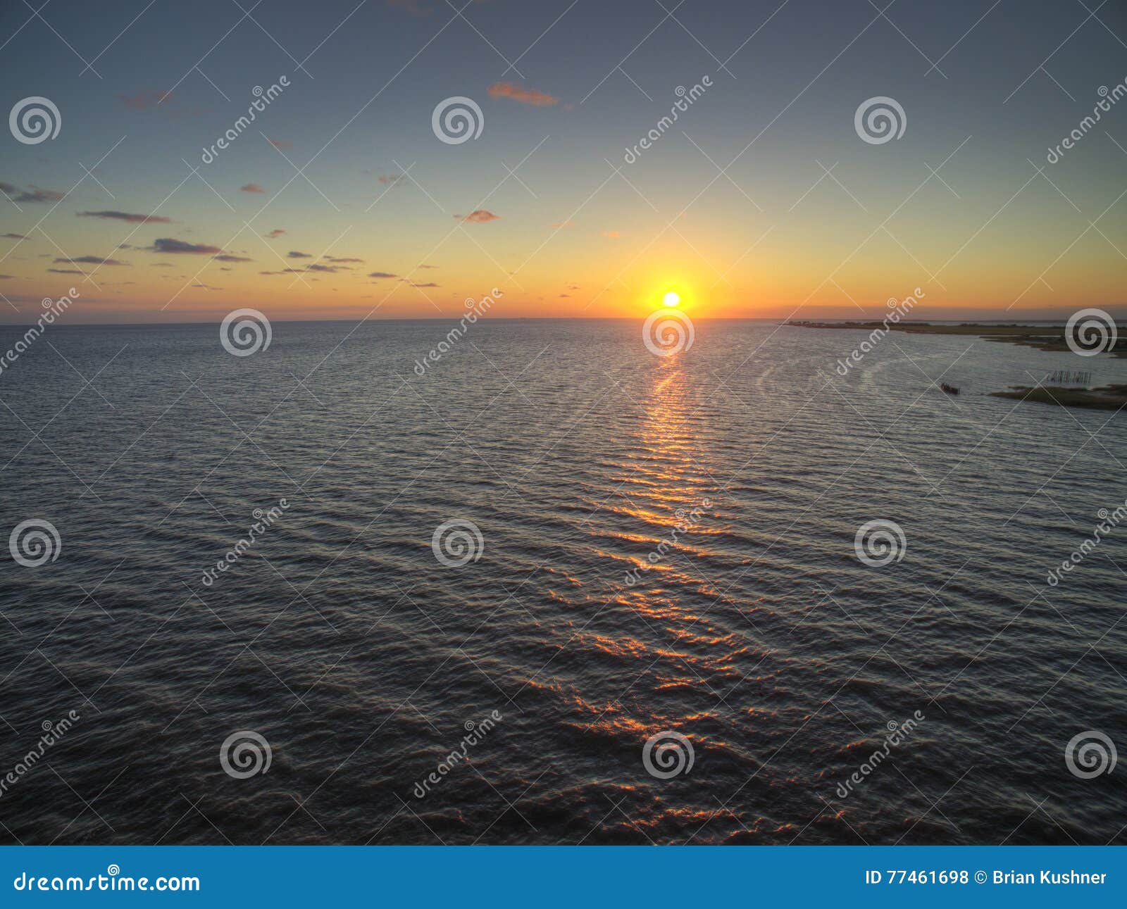 Sunset on the Water stock photo. Image of coastal, orange - 77461698