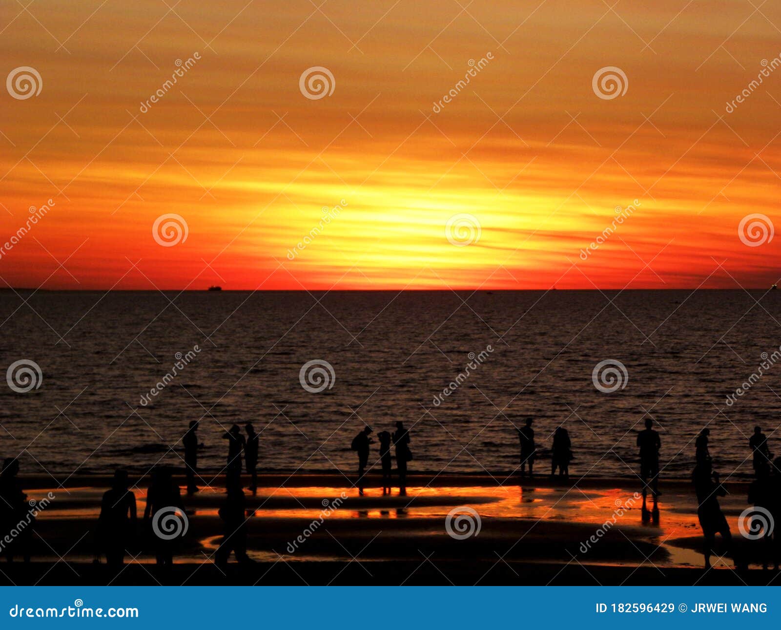 Sunsets on beach stock image. Image of people, group - 182596429
