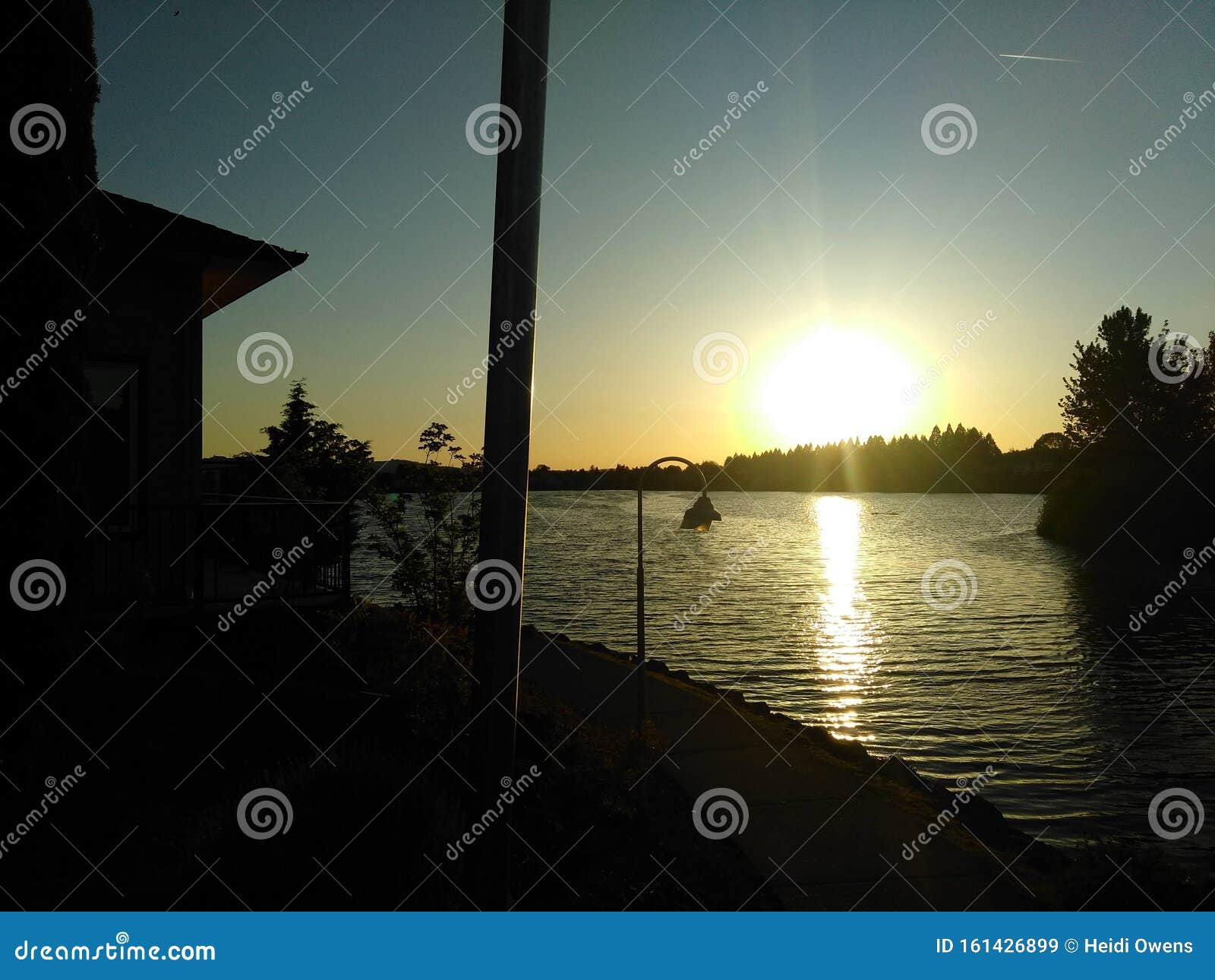 Sunsets on lake stock image. Image of shadows, sunsets - 161426899
