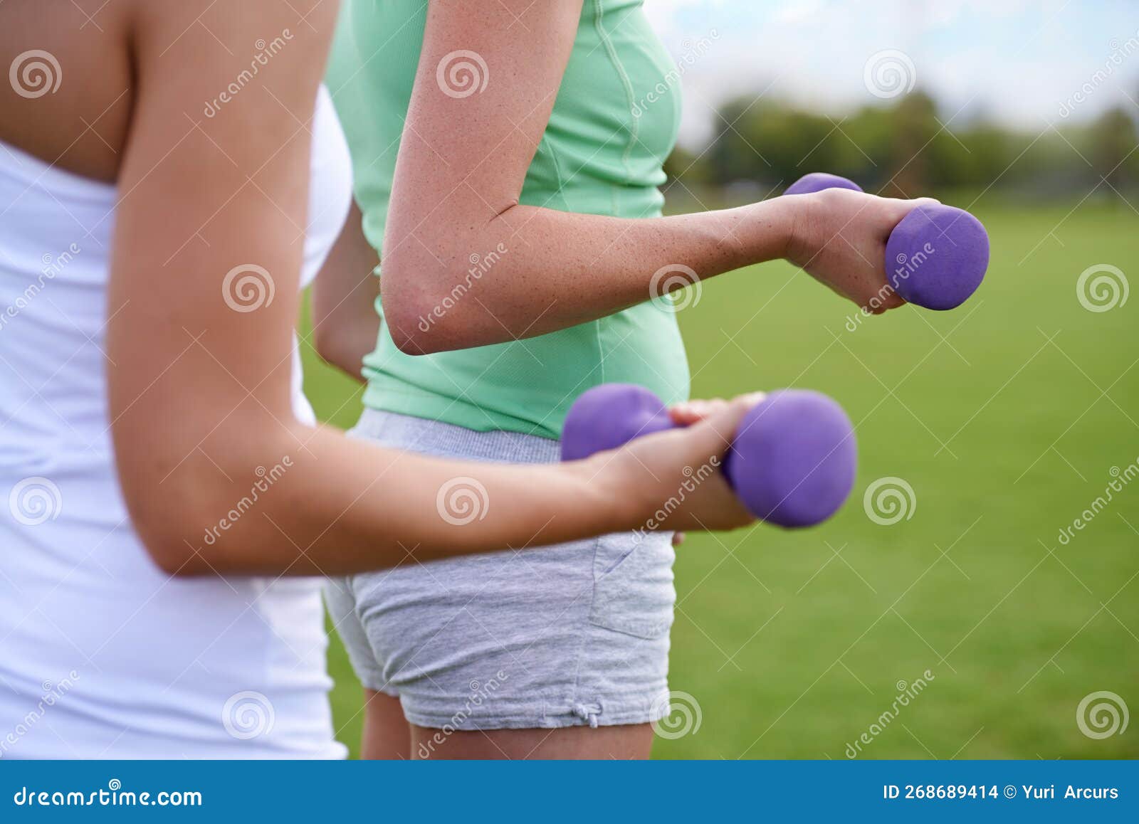 Sunshine and Exercise. a Group of Young Women Exercising Outdoors ...