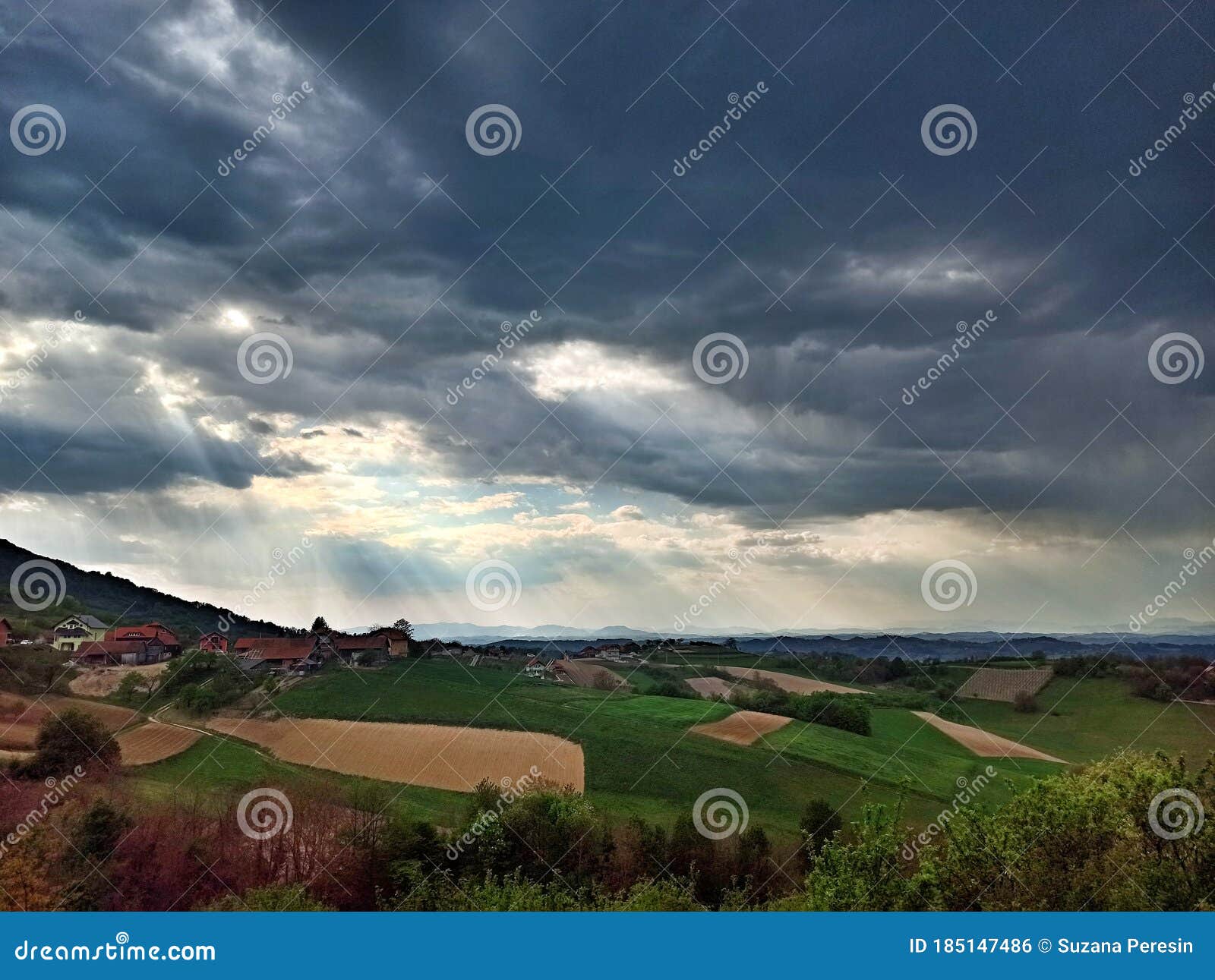 Sunshine over field stock photo. Image of hill, landscape - 185147486
