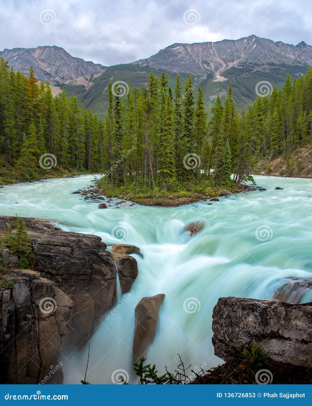 Sunwapta Falls with Blue Water Flowing in Spring, Alberta, Canada Stock ...
