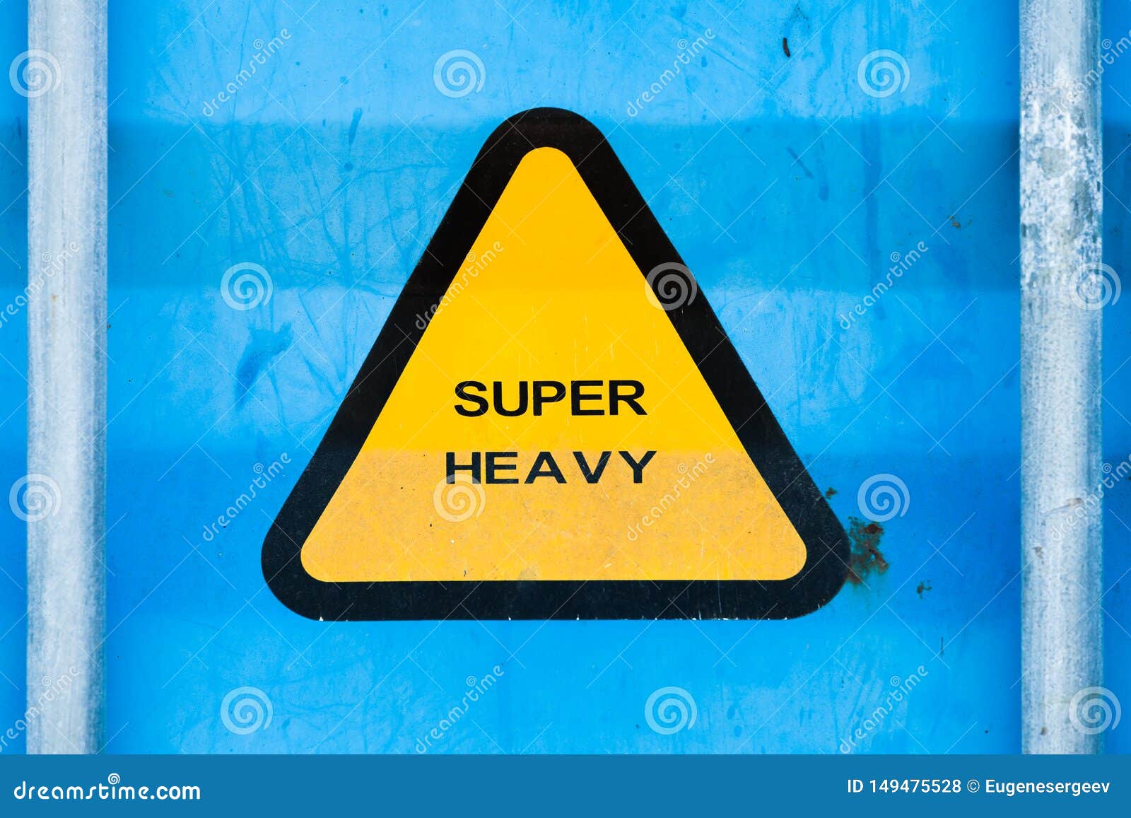 Super Heavy. Yellow Caution Sign Stock Photo - Image of global ...