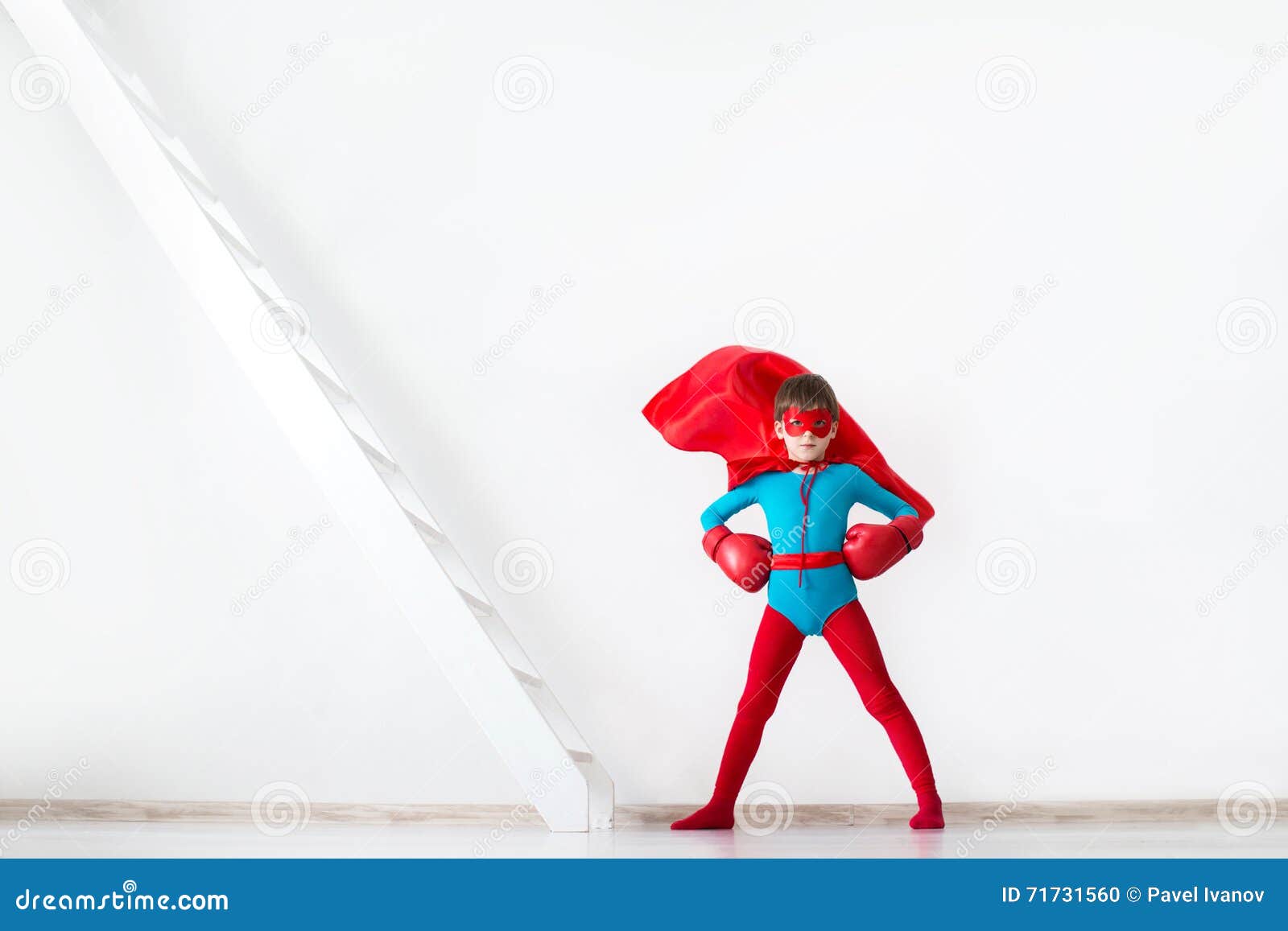 Super Hero Boy in Red Boxing Gloves and a Cape in the Wind. Stock Photo ...