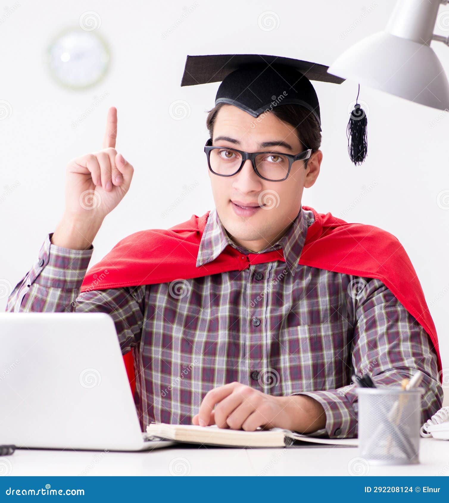 Super Hero Student Wearing a Mortarboard Studying for Exams Stock Photo ...
