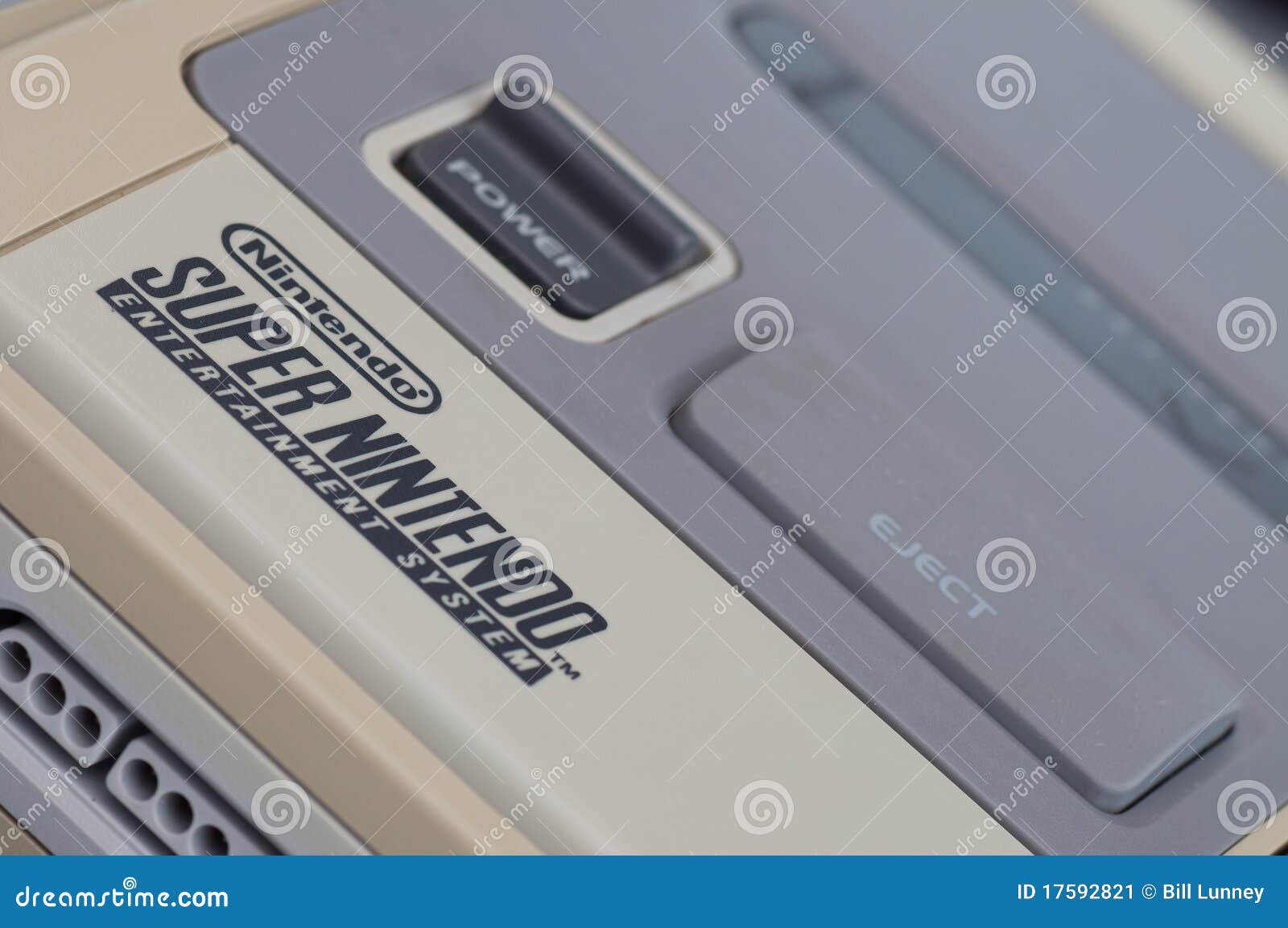 A Nintendo SNES Controller Hovering Over A Pile Of Retro Video Game ...