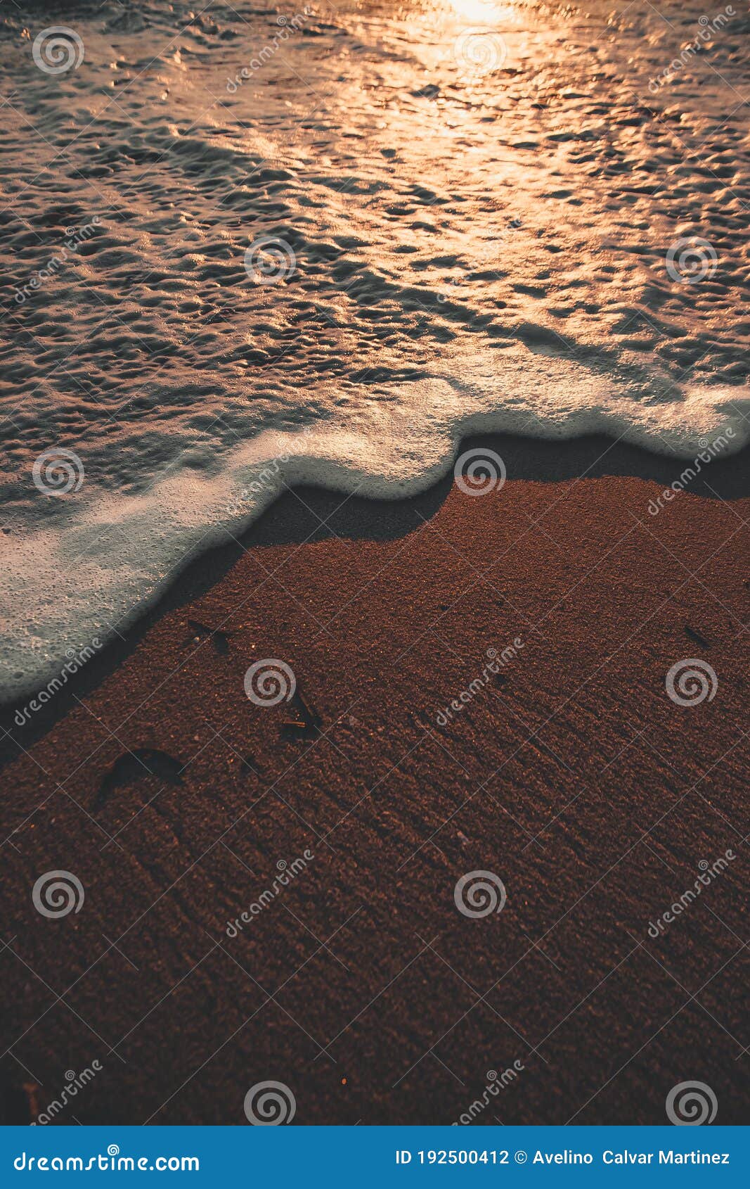 A Super Sharp Tide Over the Sand of a Beach Stock Photo - Image of ...