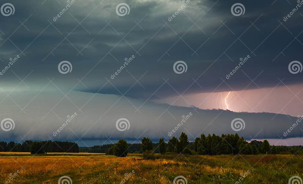 Supercell Cloud with Distant Lightning Illuminating the Storm Structure ...