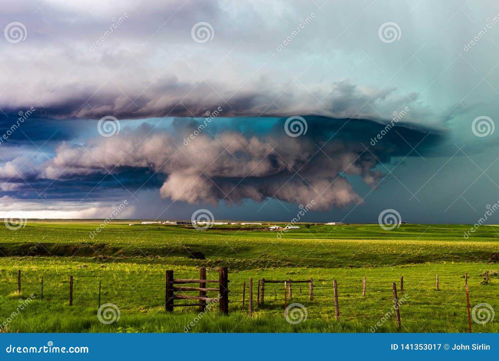 Ominous Storm Clouds Over a Field Stock Image - Image of wall ...