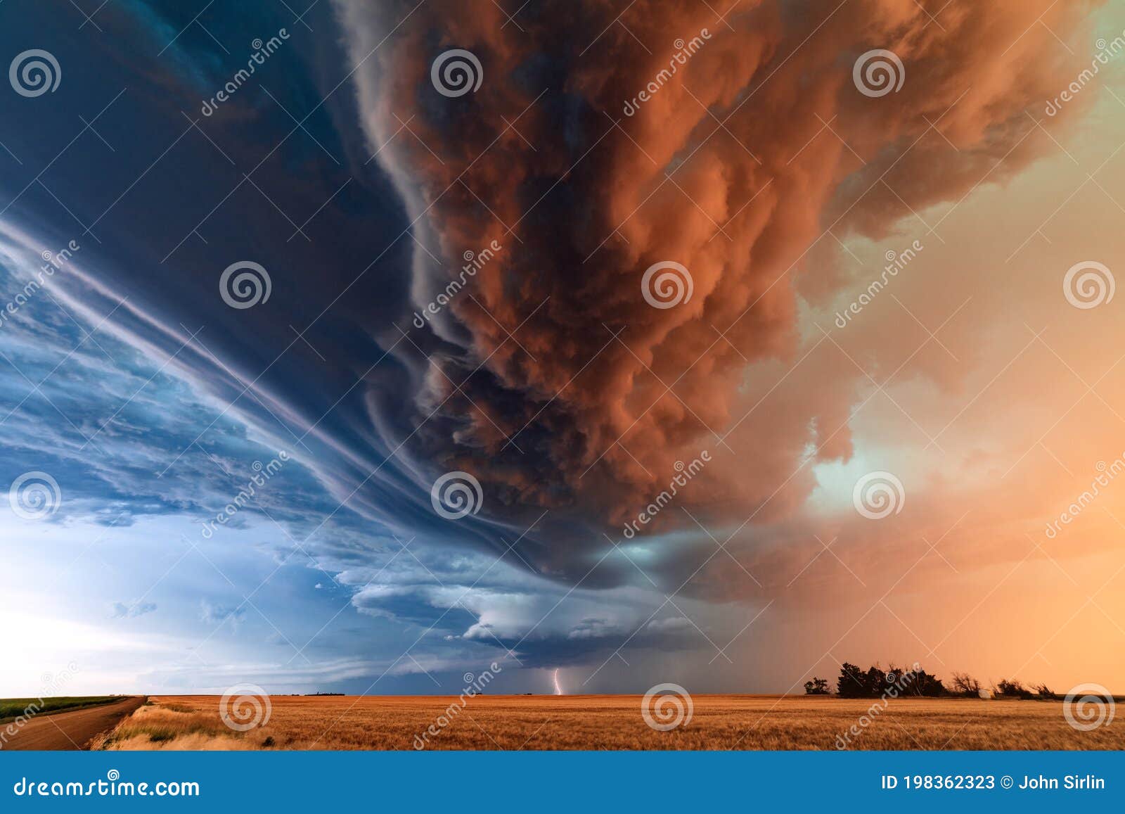 Dramatic Storm Clouds Glow Gold At Sunset Over The Drakensberg ...