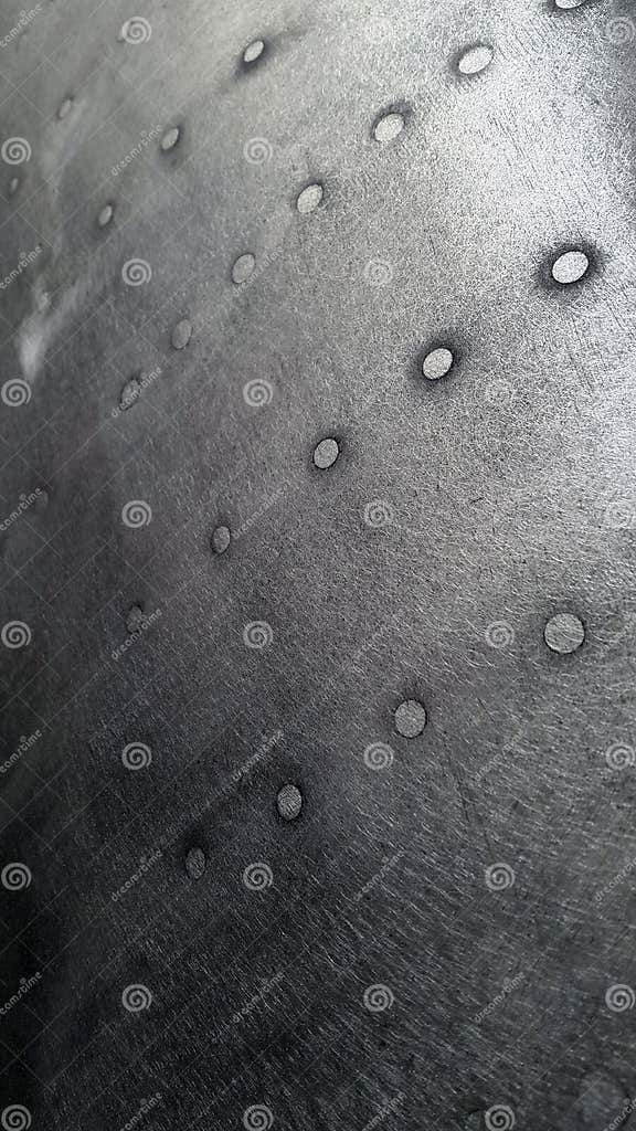 Superficie De Metal Remachado. Metal Antiguo Con Remaches Imagen de ...