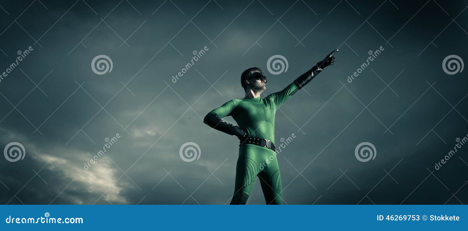Superhero Pointing with Dramatic Background Stock Image - Image of ...