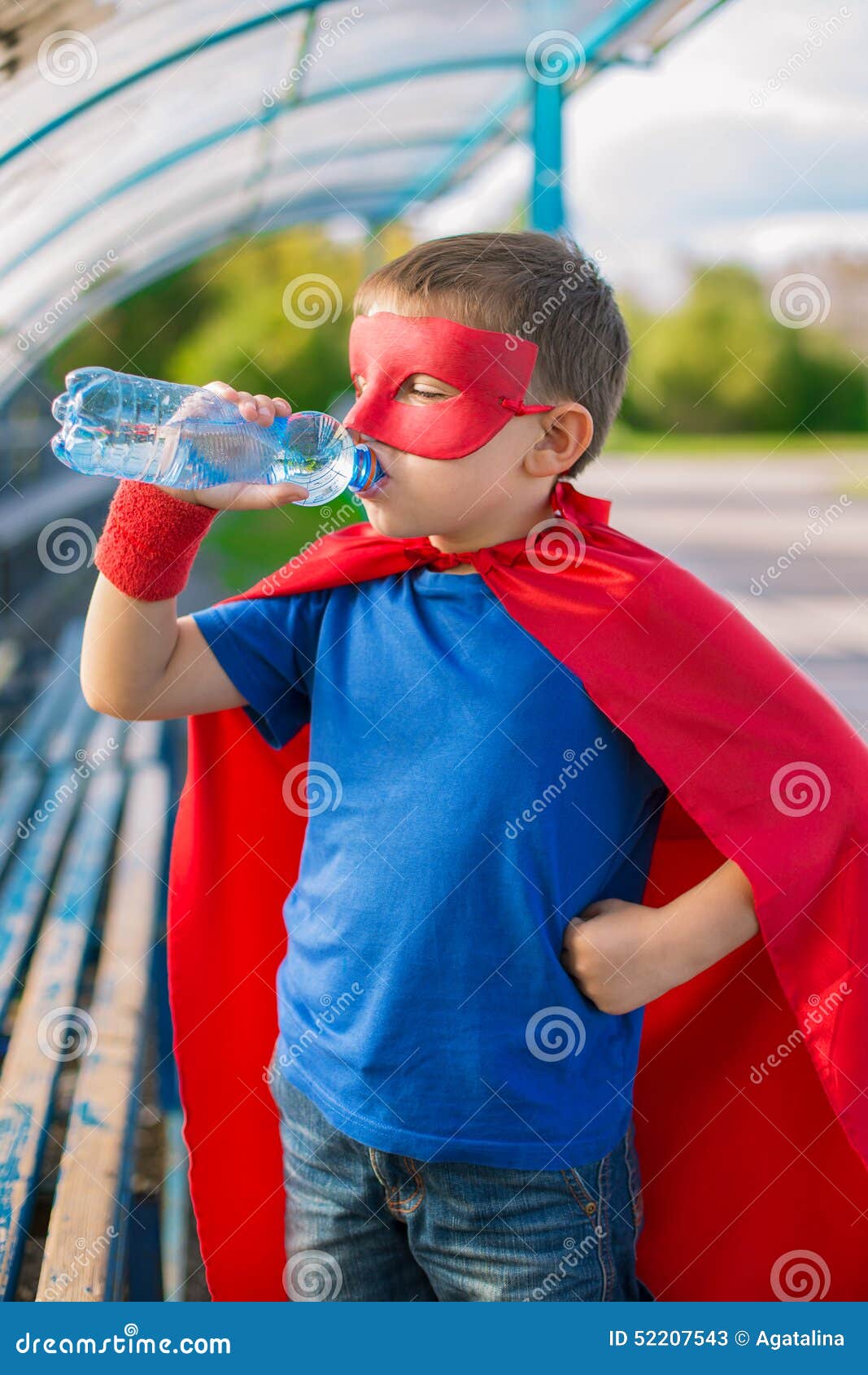 Superhero Standing and Drinking Water from a Bottle Stock Image - Image ...