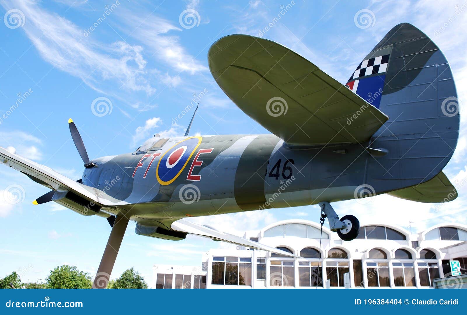 Supermarine Spitfire Fighter on Display. Clouds and Blue Sky on ...