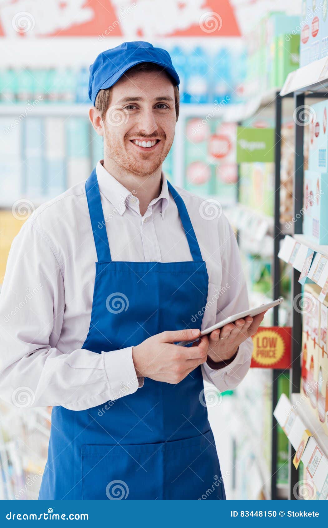 Supermarket Clerk Using a Tablet Stock Photo - Image of products ...
