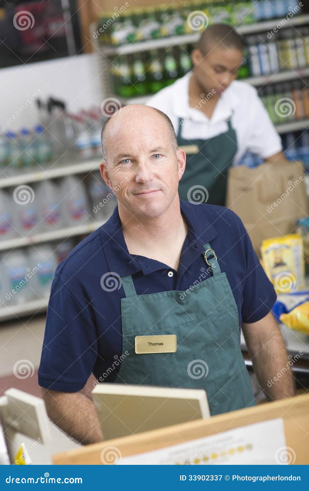 Supermarket Employee and Checkout Assistant Stock Image - Image of ...