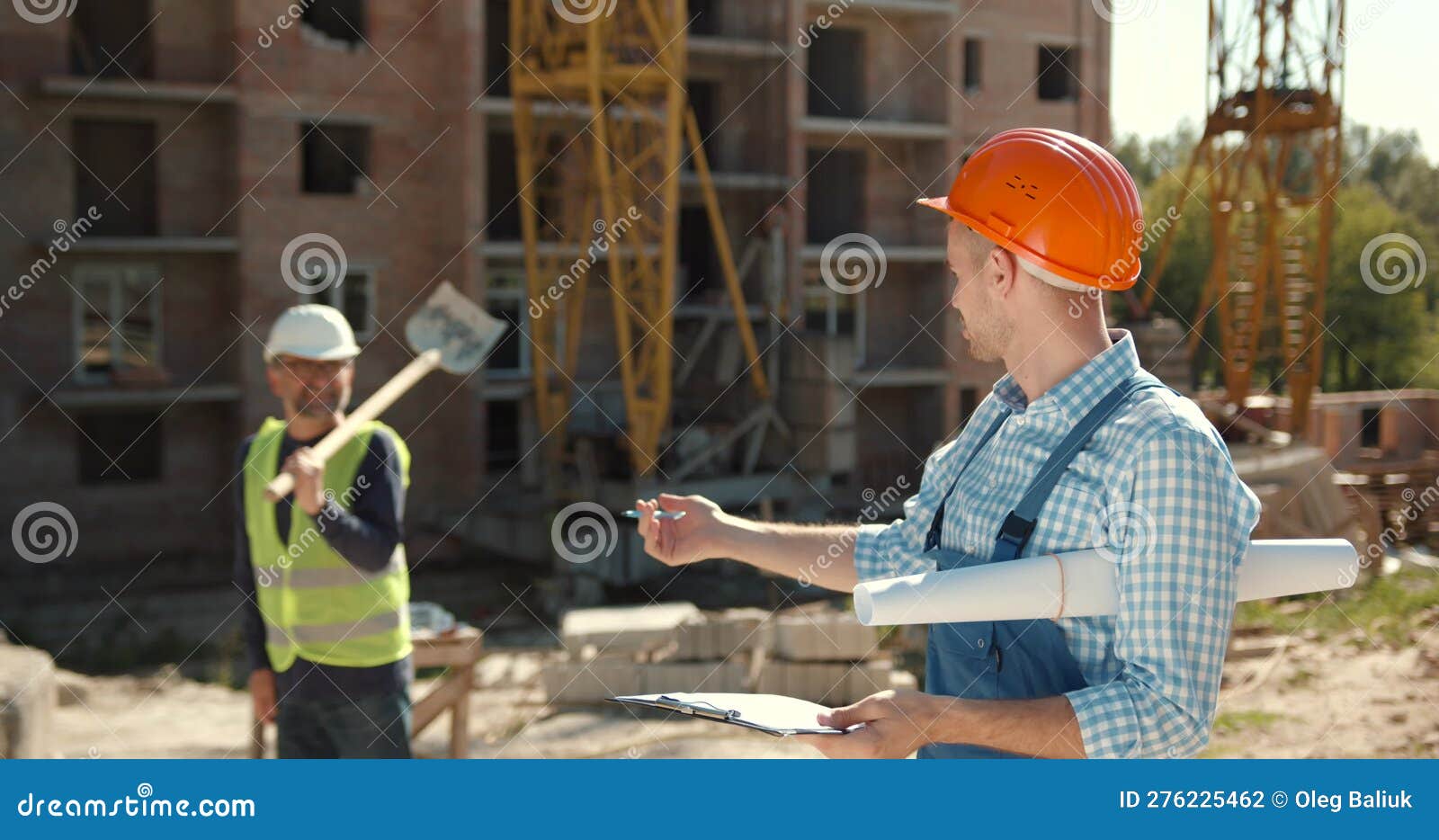 Superviser with Blueprint Standing at Construction Site Stock Footage ...