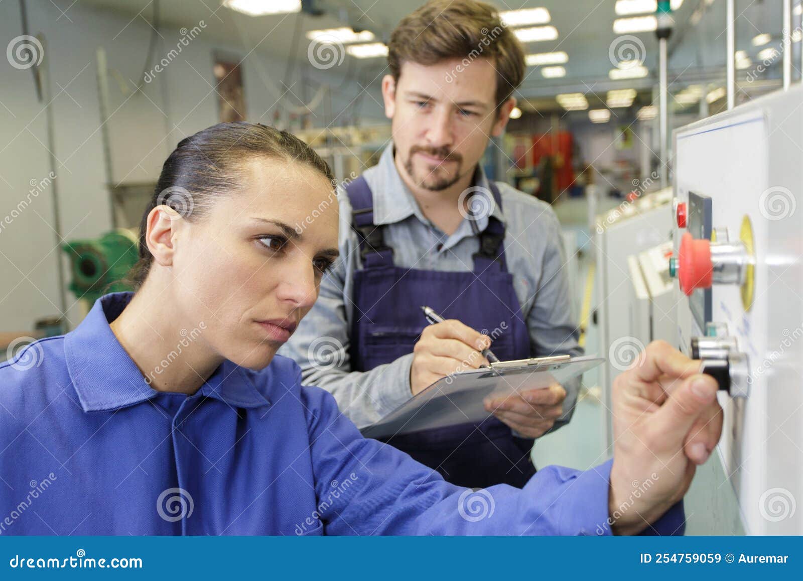 Supervisor Assessing Female Factory Worker Using Machinery Stock Image ...