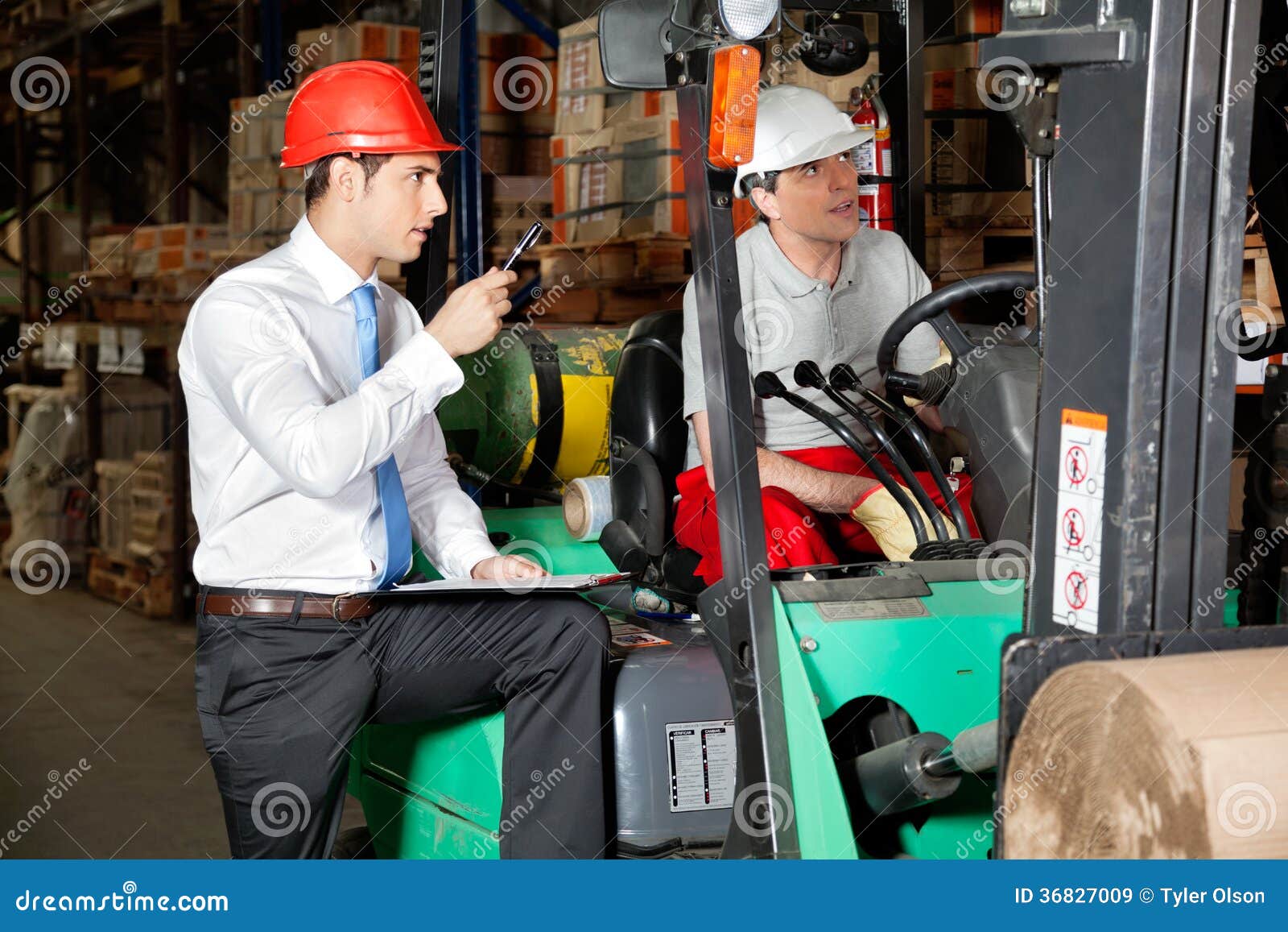 Supervisor with Clipboard Instructing Forklift Stock Image - Image of ...