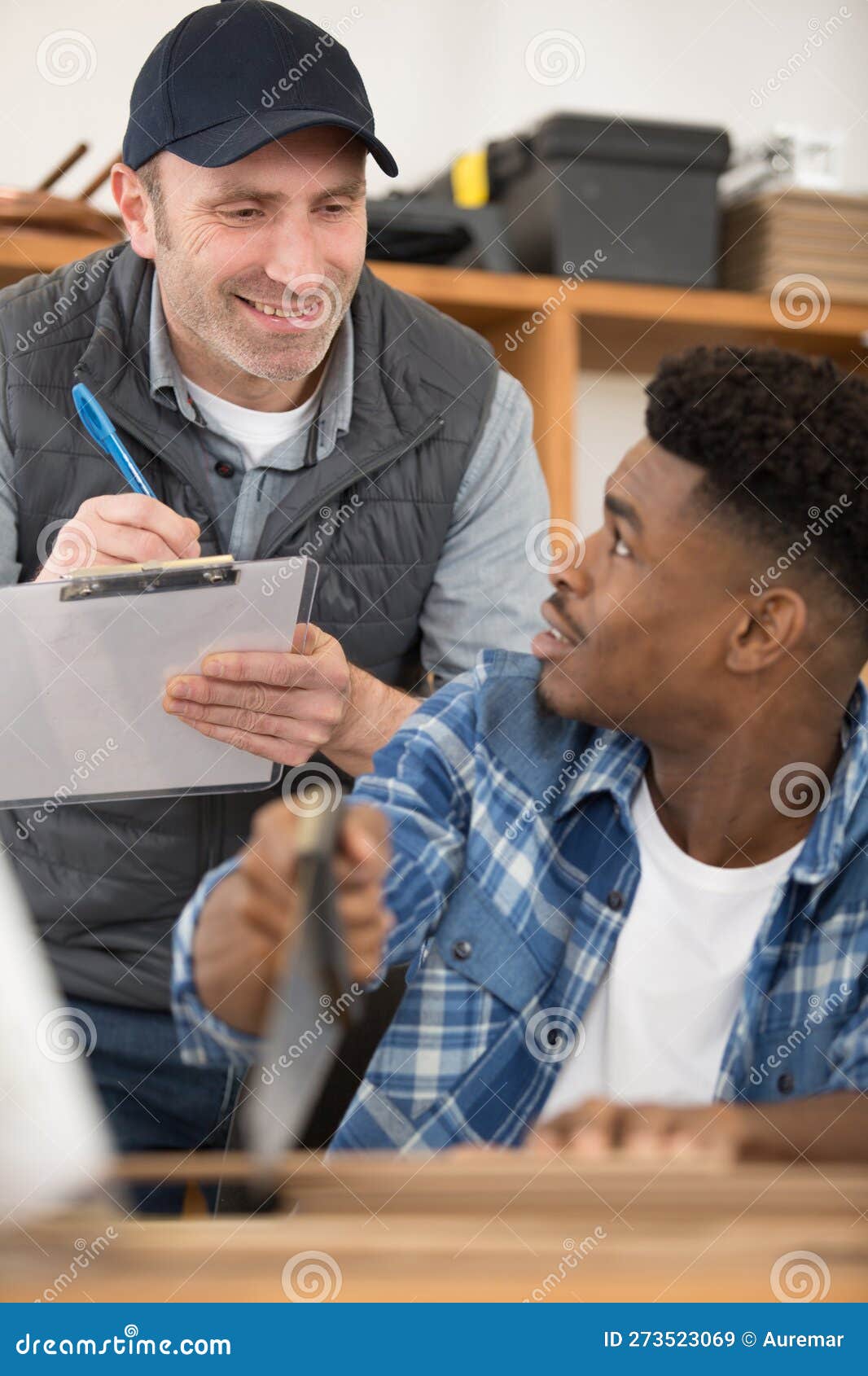 Supervisor Encouraging Male Apprentice Carpenter Stock Image - Image of ...