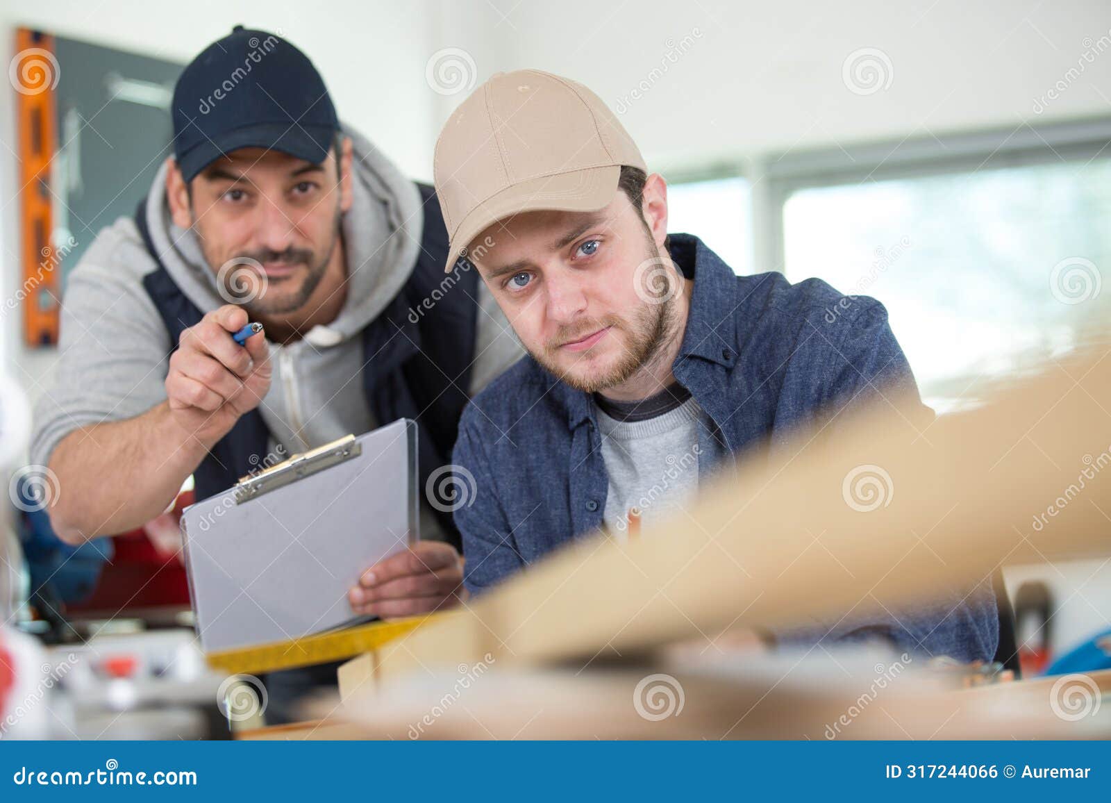 Supervisor Guiding Apprentice in Carpentry Skills Stock Photo - Image ...