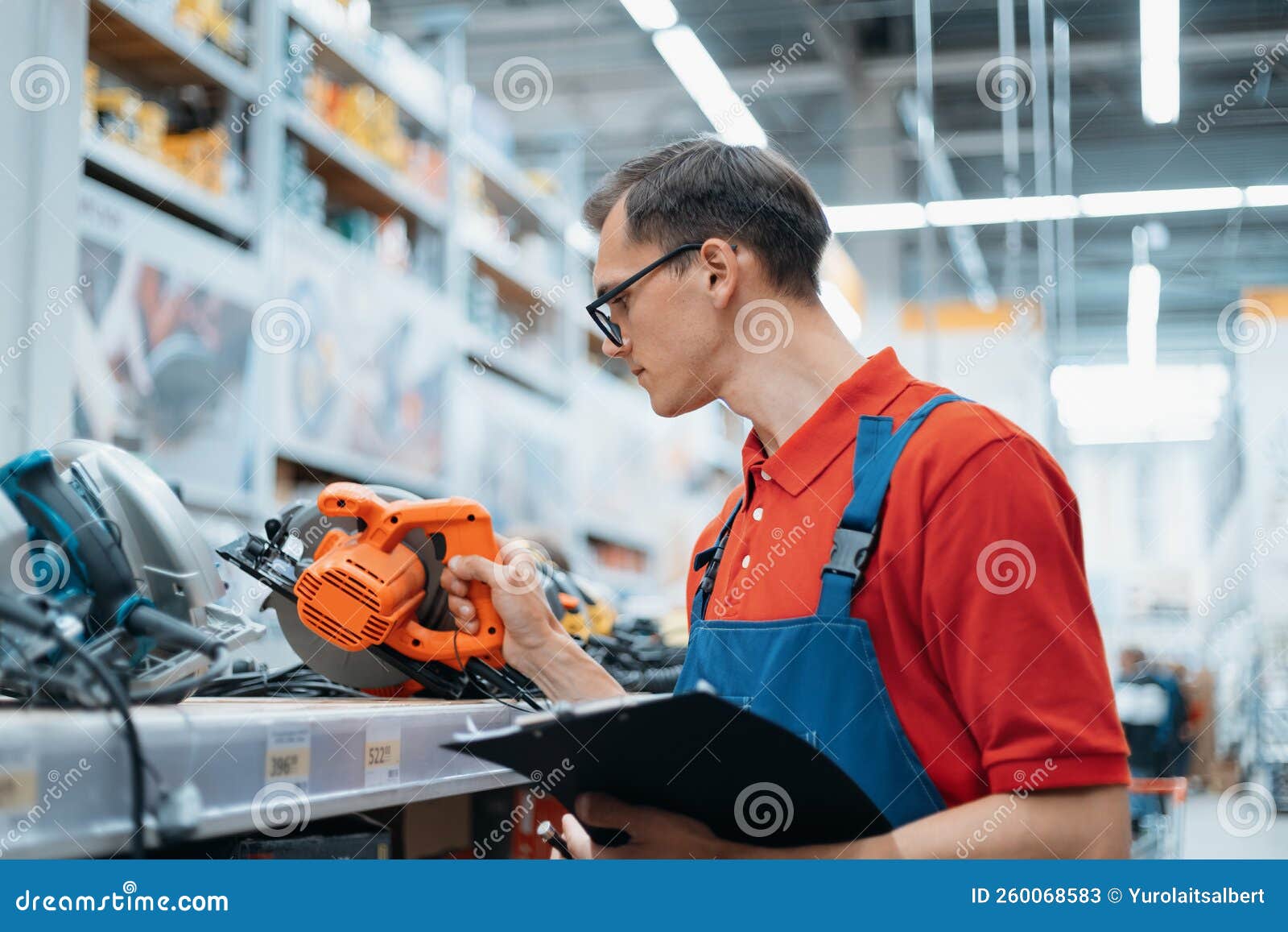 Supervisor of the Hardware Store Checking the Markings on the Power ...