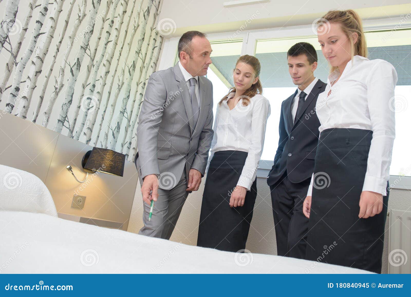 Supervisor with Hotel Staff Stock Image - Image of uniform ...