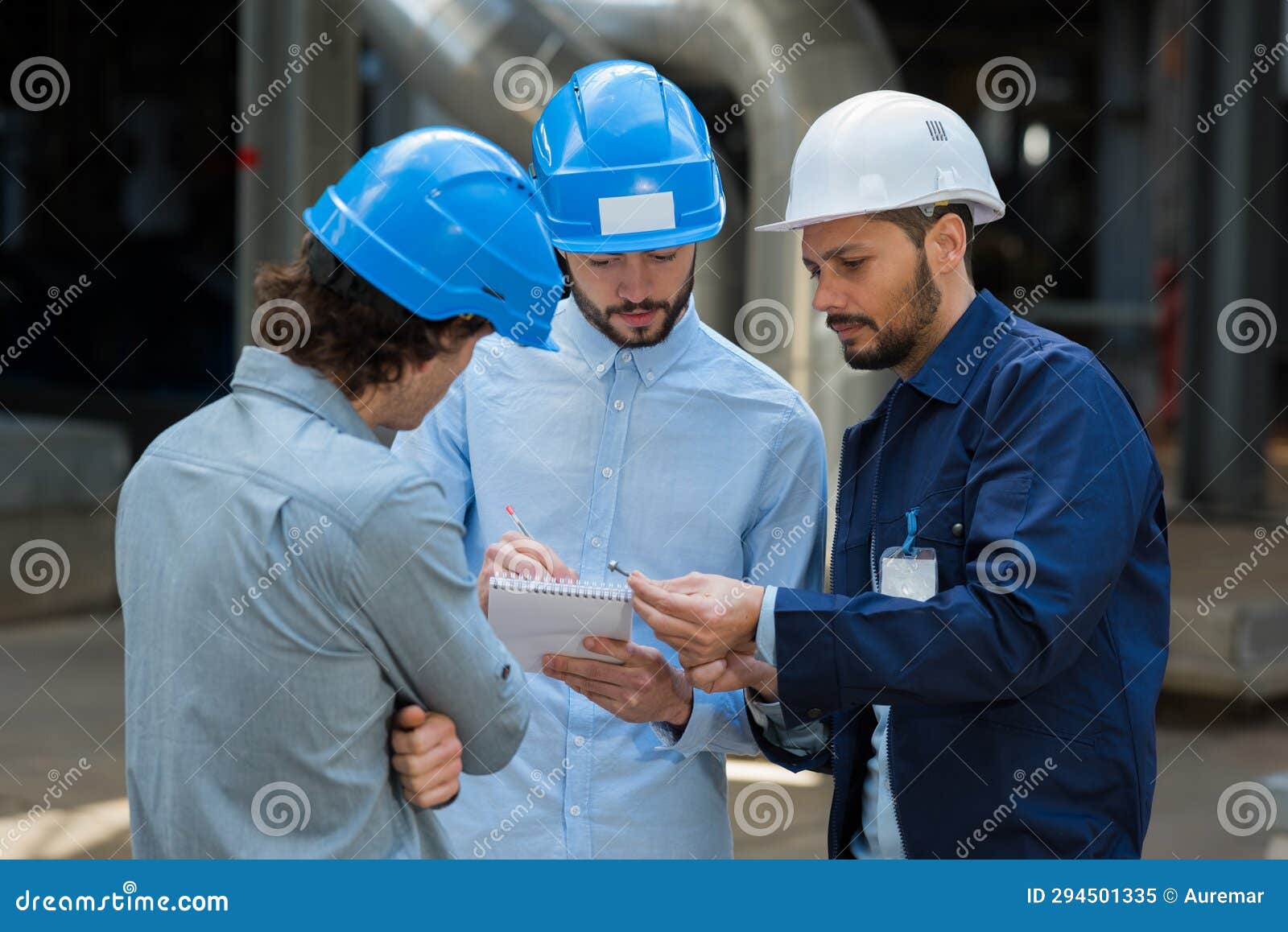 Supervisor and Manual Workers Discussing in Industry Stock Image ...
